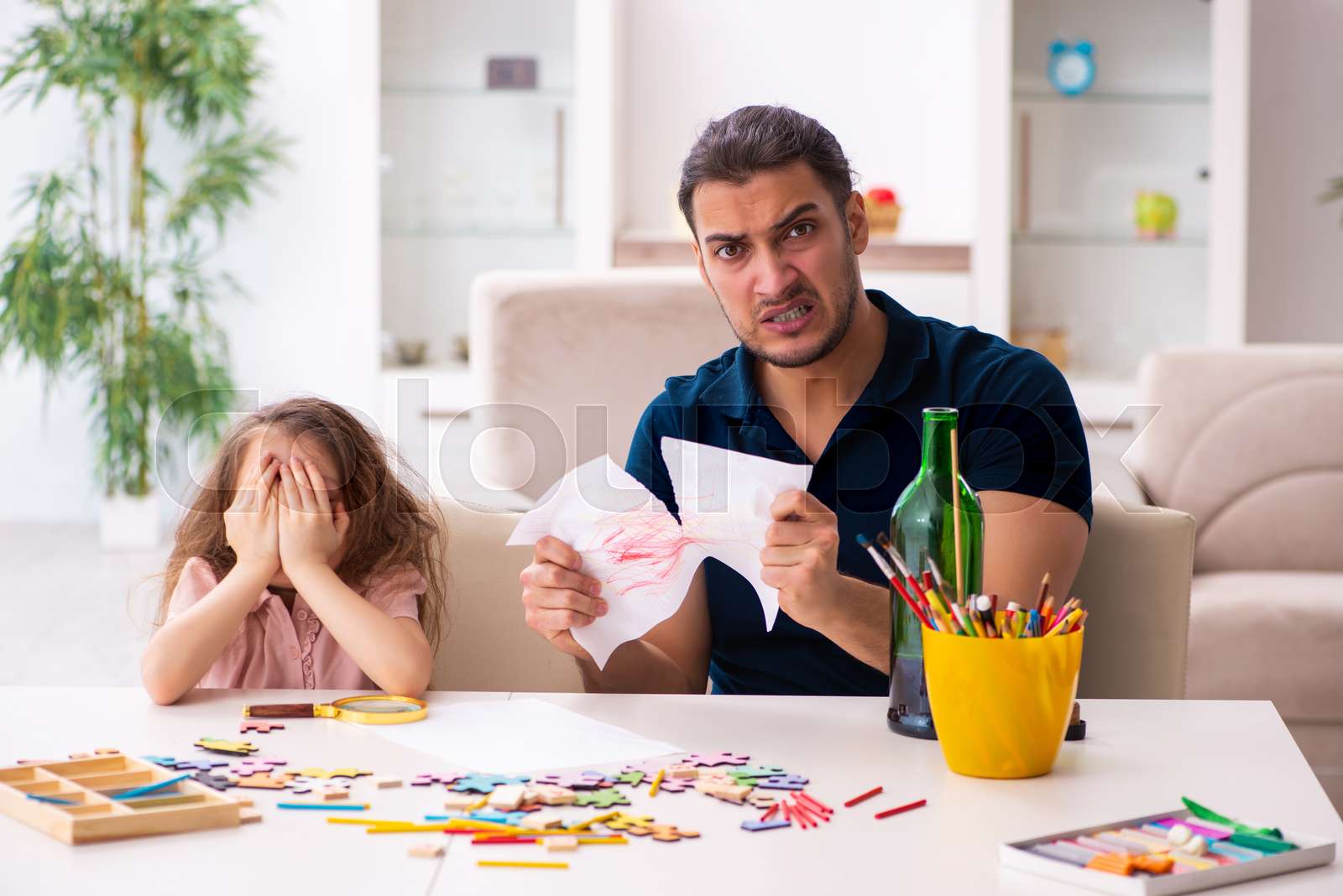Drunk father and little girl indoors | Stock image | Colourbox