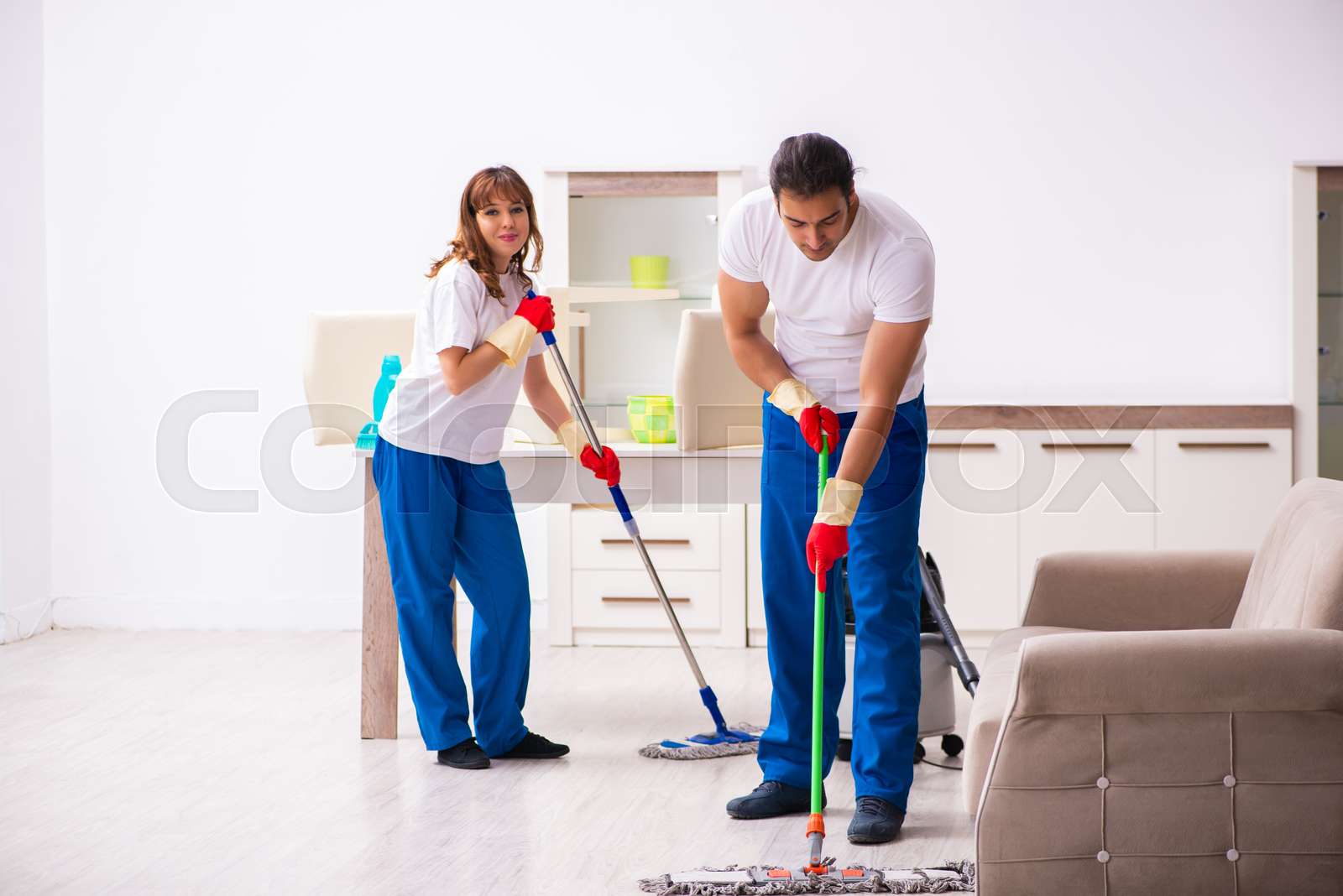 Young pair doing housework at home | Stock image | Colourbox