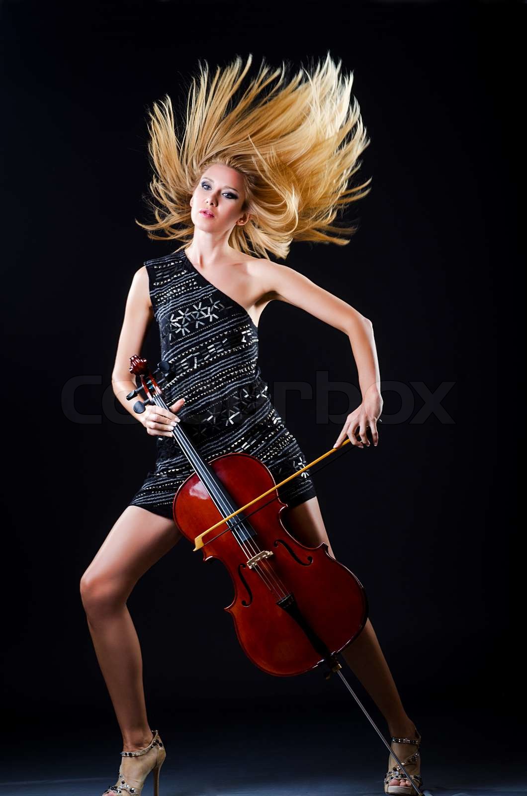 Woman playing cello on white | Stock image | Colourbox
