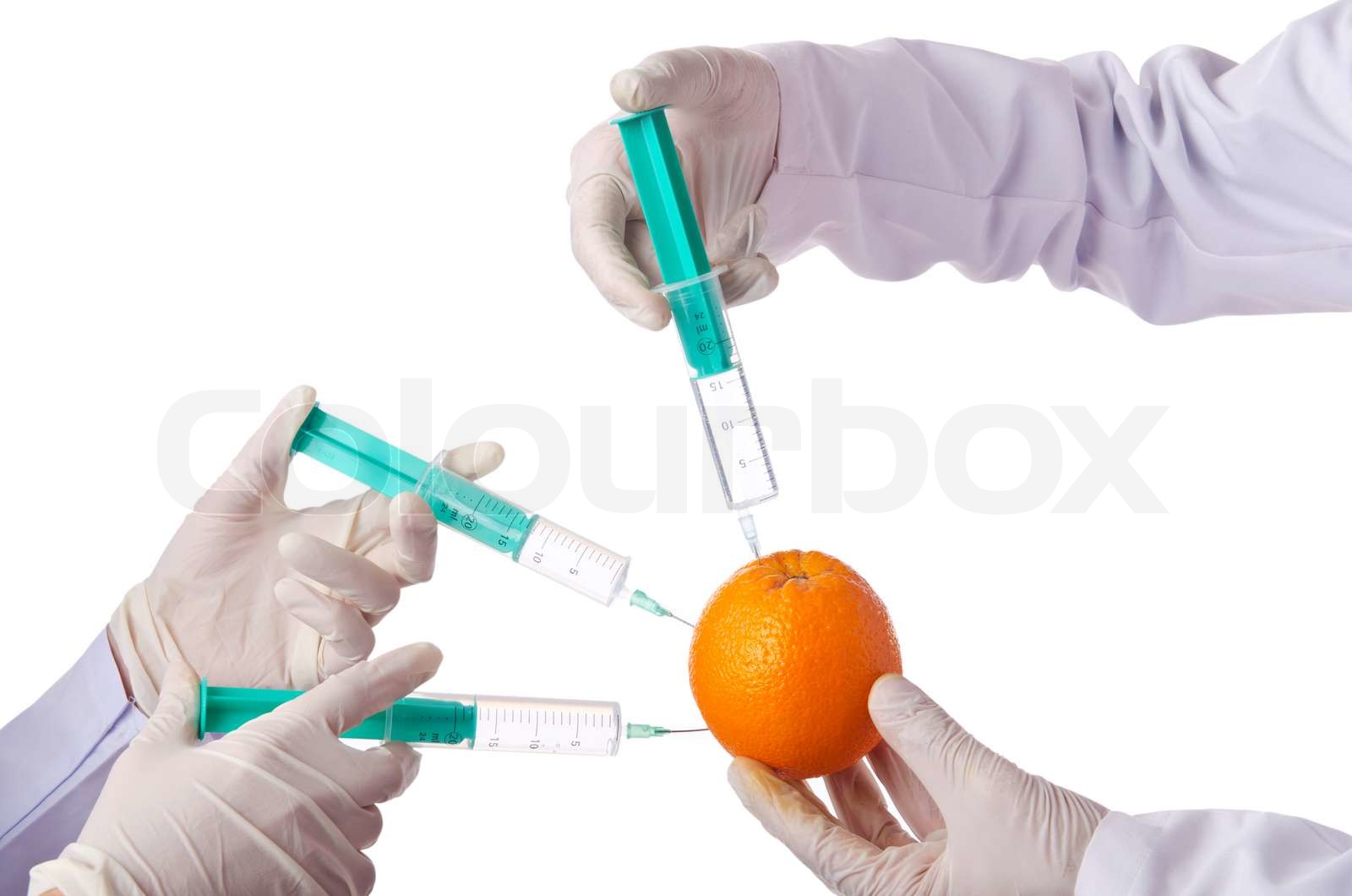 Science experiment with orange and syringe | Stock image | Colourbox