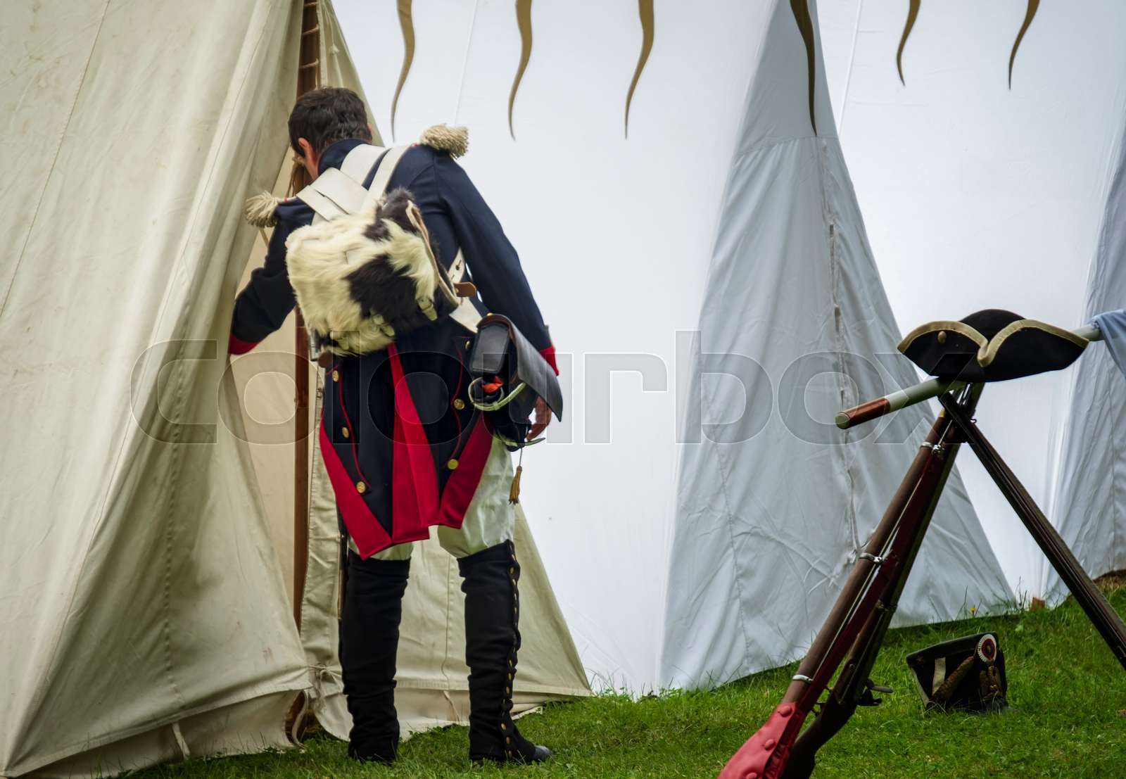 napoleonic soldier looks into the tent | Stock image | Colourbox