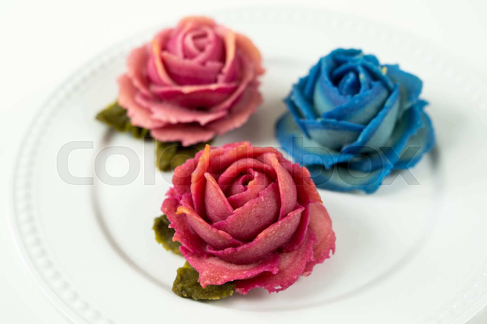 Blue and red rose flower mooncake | Stock image | Colourbox