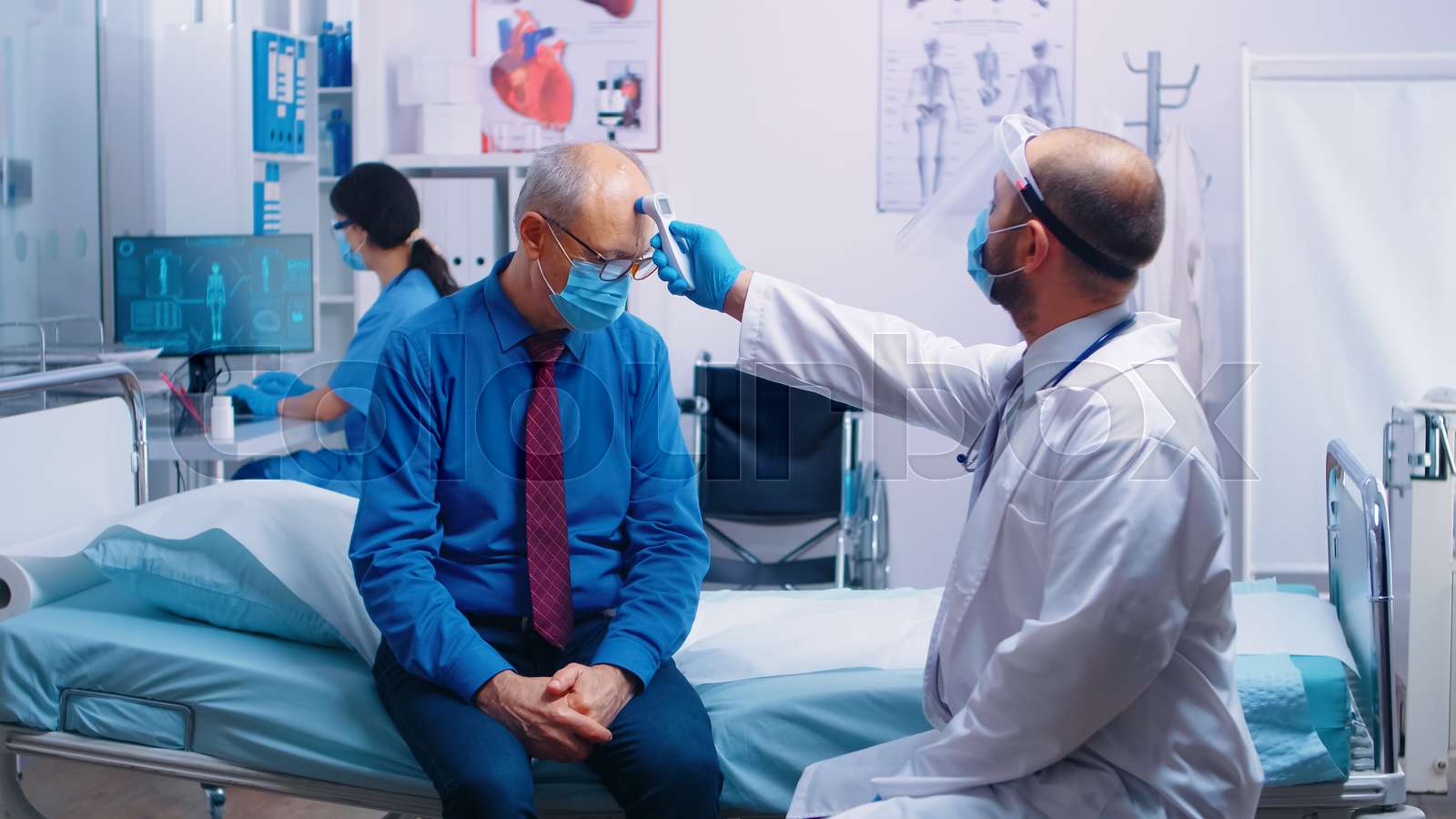 Measuring temperature in private hospital | Stock image | Colourbox