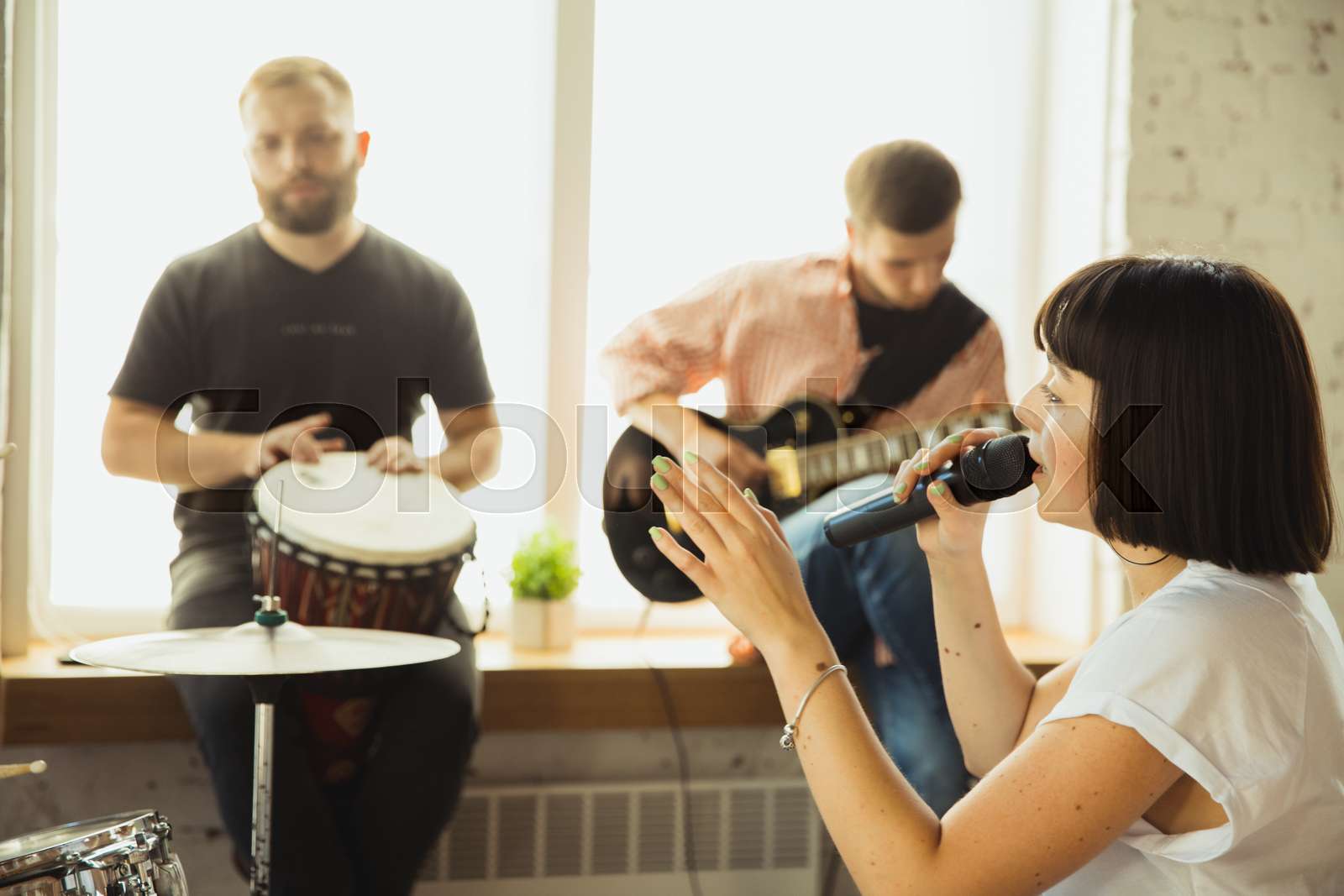 Musician Band Jamming Together In Art Workplace With Instruments