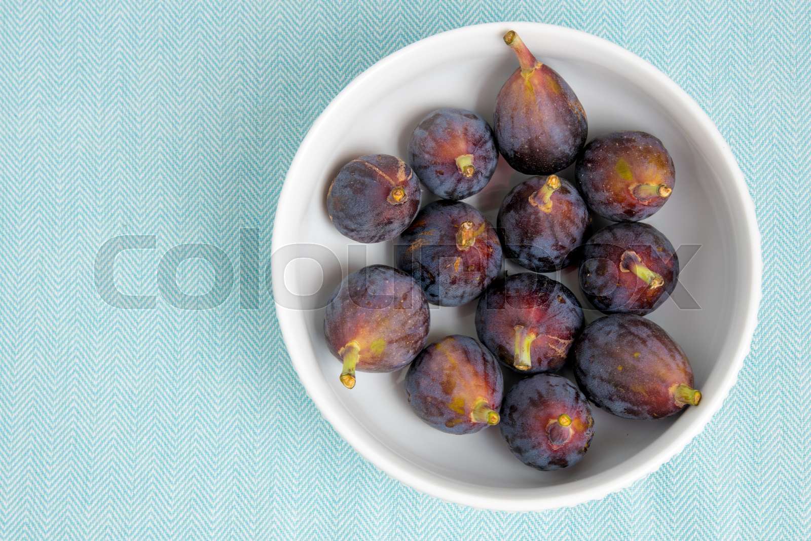 Figs fruits in a bowl, top view. | Stock image | Colourbox