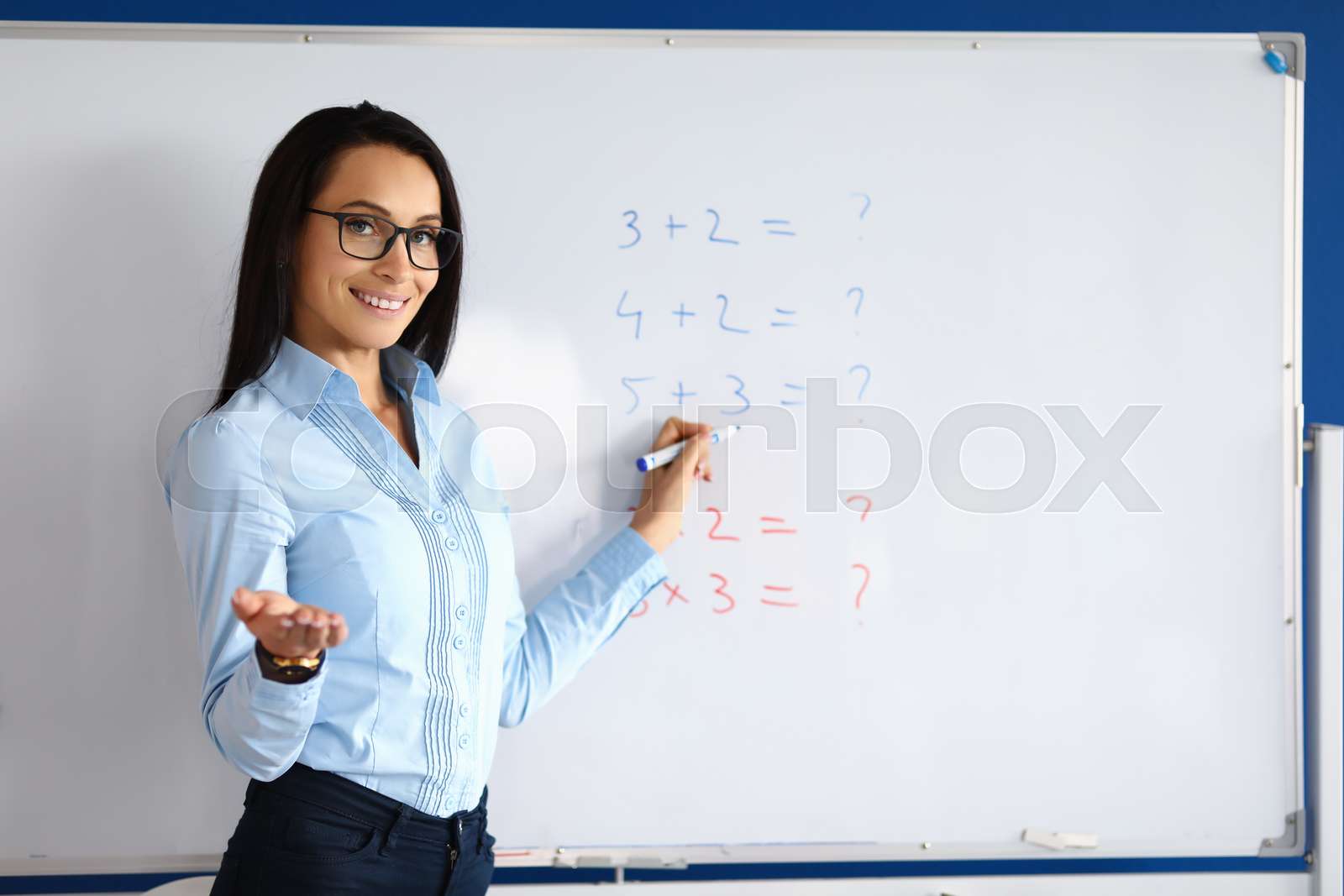 Happy pretty female at work | Stock image | Colourbox