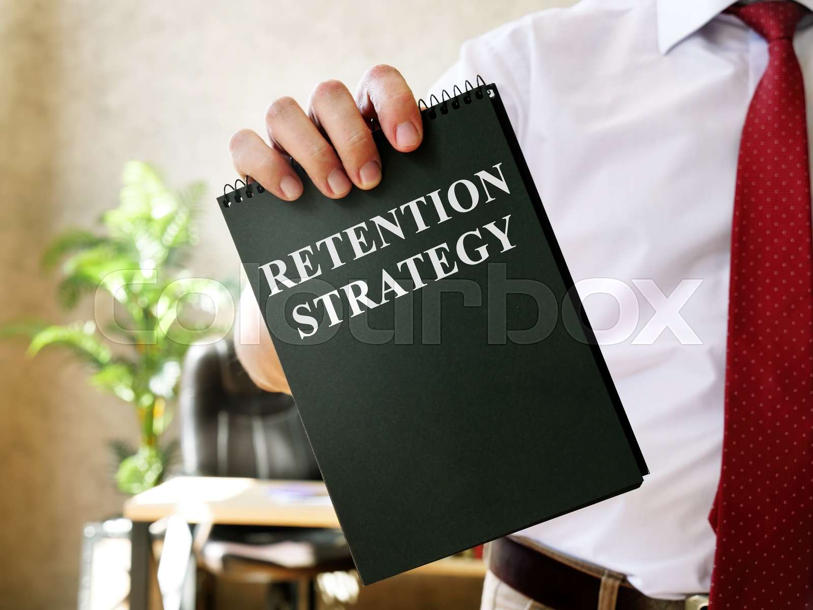 The manager demonstrates the retention strategy plan. | Stock image ... The manager demonstrates the retention strategy plan. | Stock image ...
