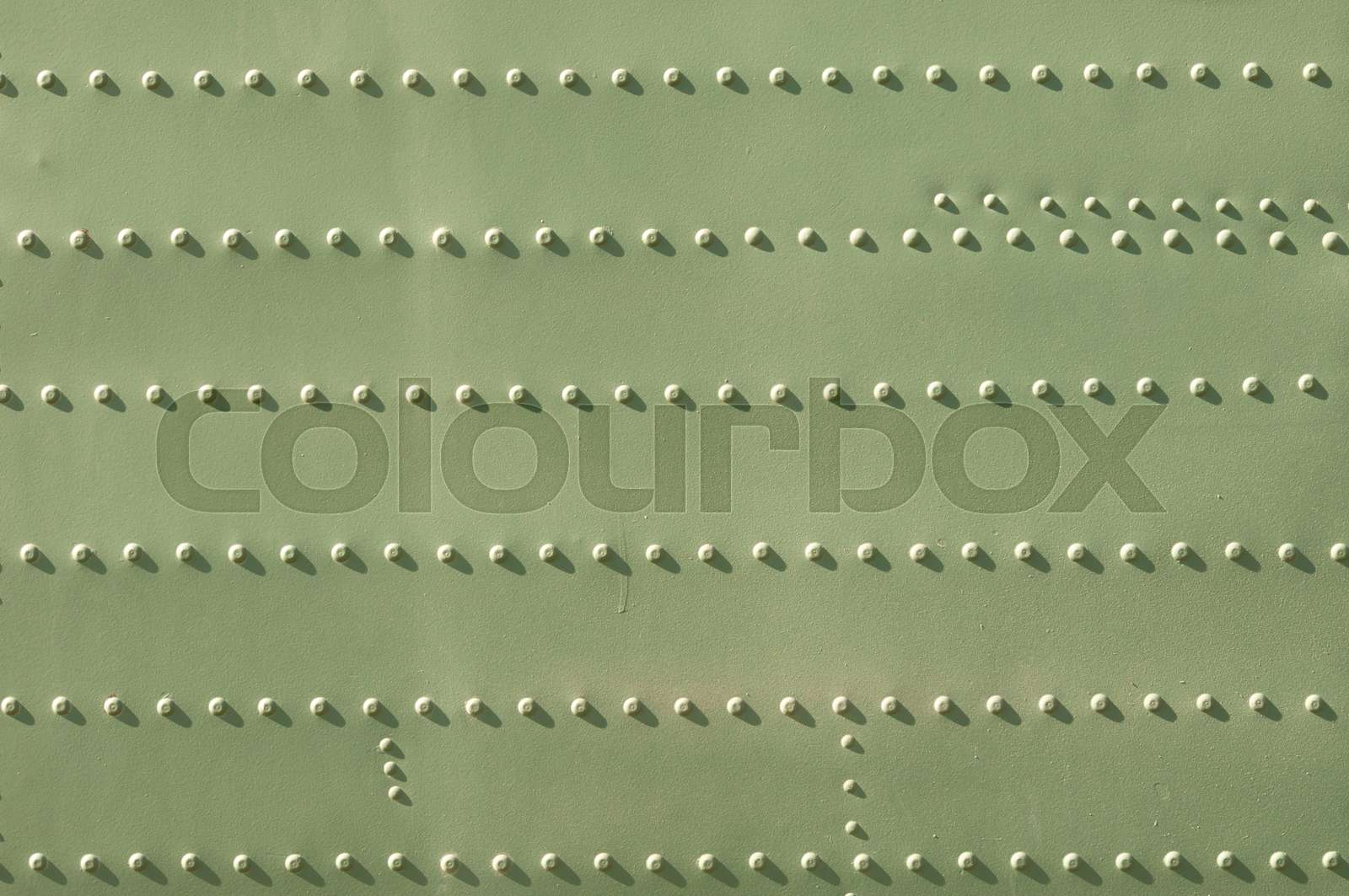 Military metal steel texture with lots of rivets. | Stock image | Colourbox