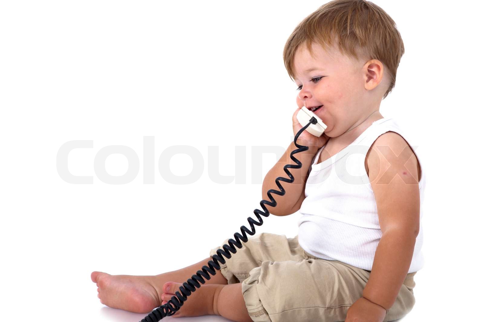 handsome baby boy talking on the phone | Stock image | Colourbox