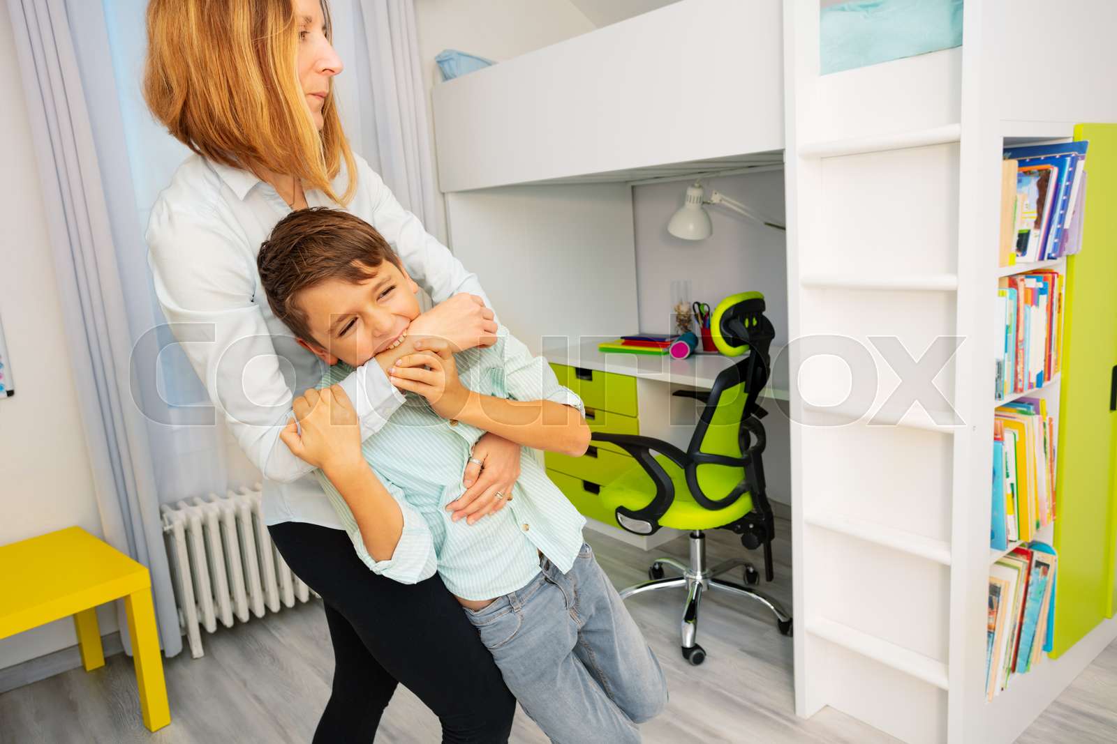 Autistic boy bite teacher's hand shows pain | Stock image | Colourbox