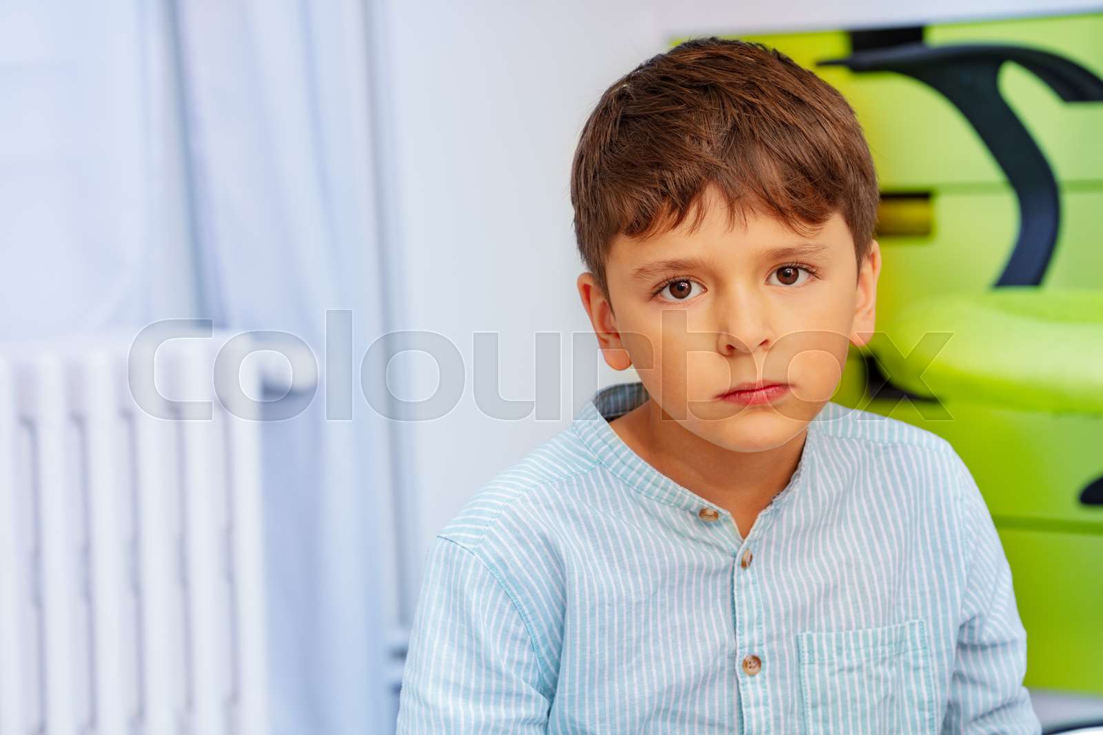 Sad boy close face portrait in his room | Stock image | Colourbox