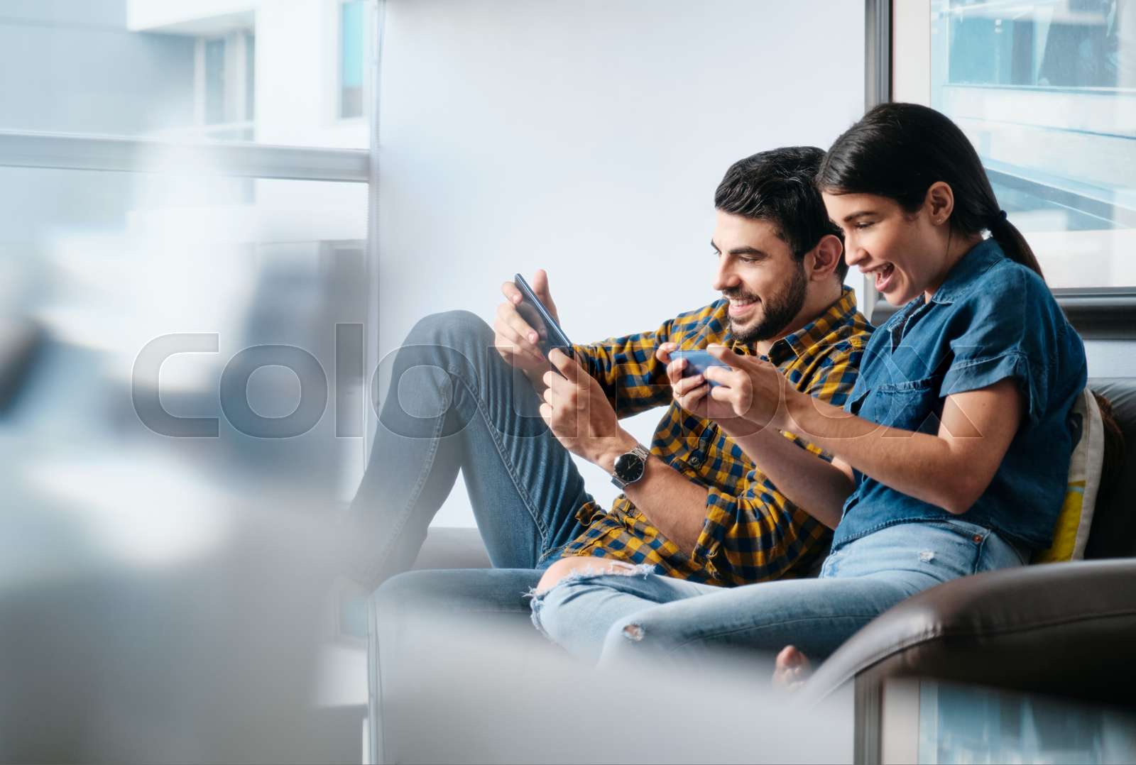 Happy People Playing Video Game With Smartphone And Laughing | Stock ...
