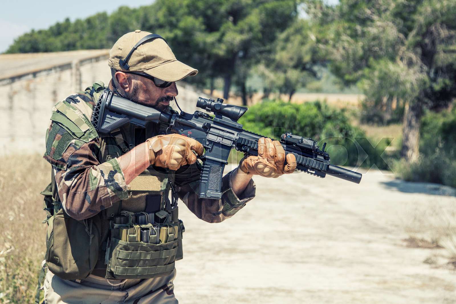 Private military company mercenary with gun | Stock image | Colourbox