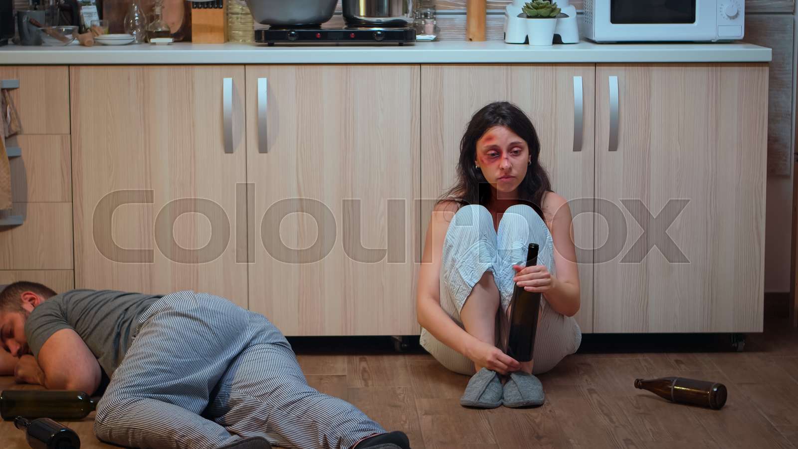 Wife drinking alcohol near drunk husband | Stock image | Colourbox