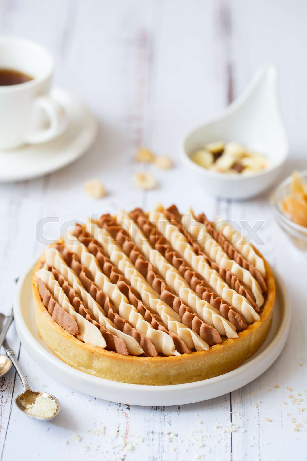 Delicious mini tarts with nuts and custard. Assortment of delicious and ...