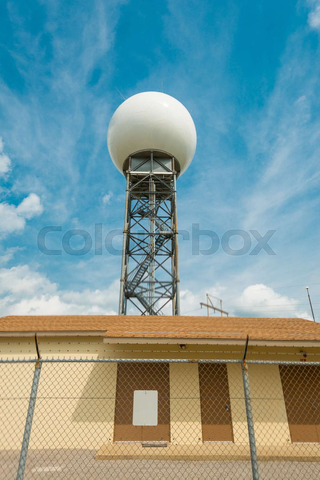 Radar Tower Behind a Fence With Partly Blue Skies. | Stock image ...