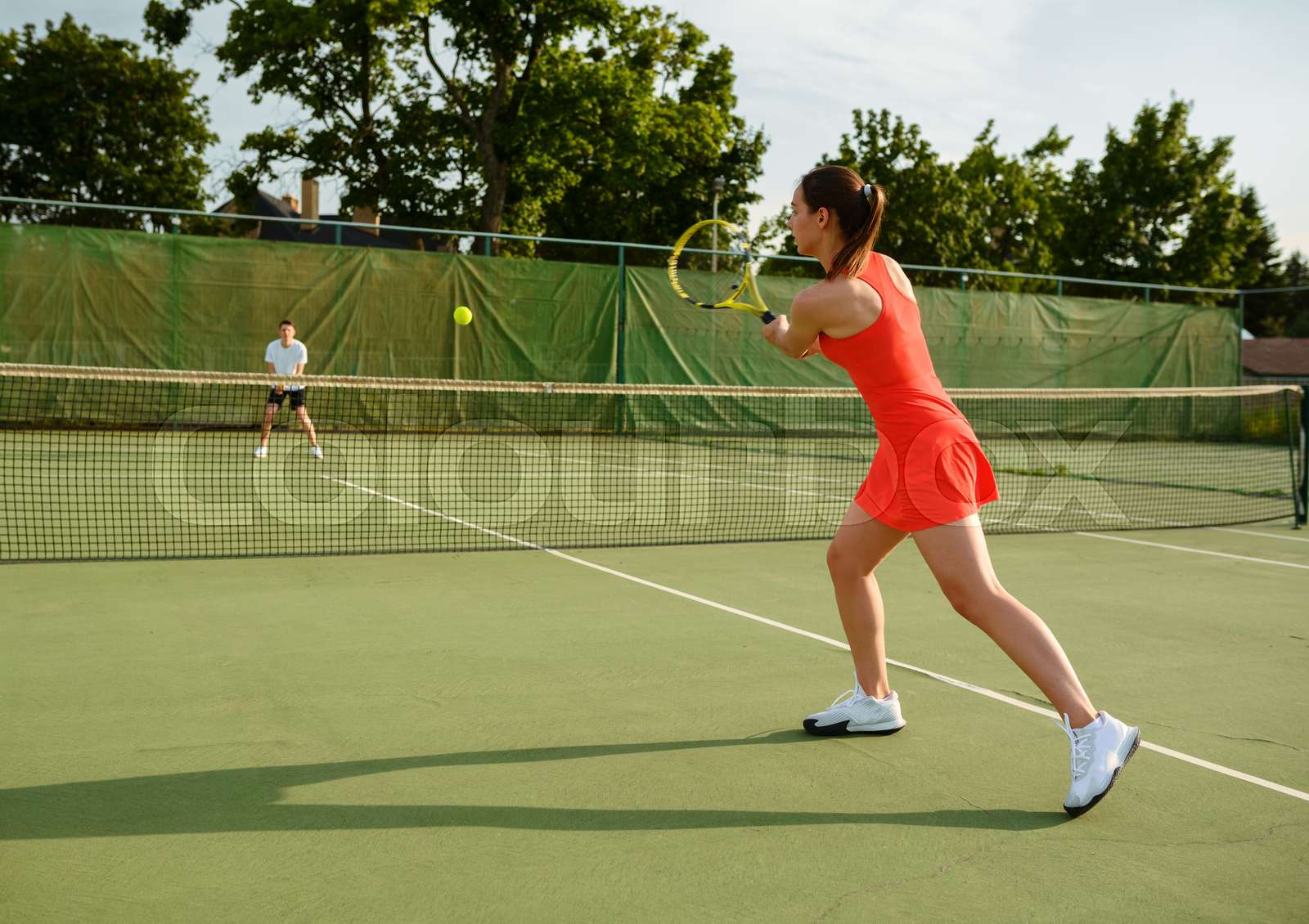 Tennis players, training on outdoor court | Stock image | Colourbox