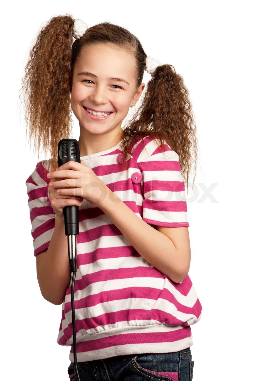 Girl with microphone | Stock image | Colourbox