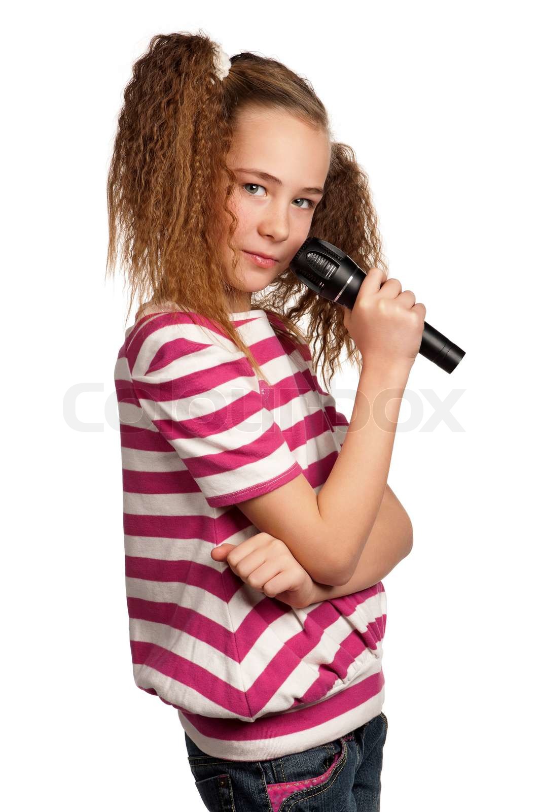 Girl with microphone | Stock image | Colourbox