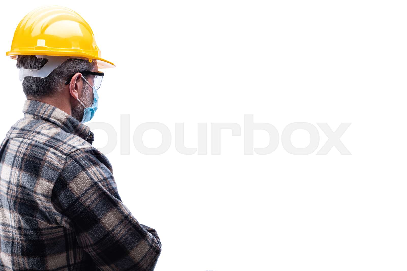 Carpenter at work protects the face with the surgical mask. Carpentry ...