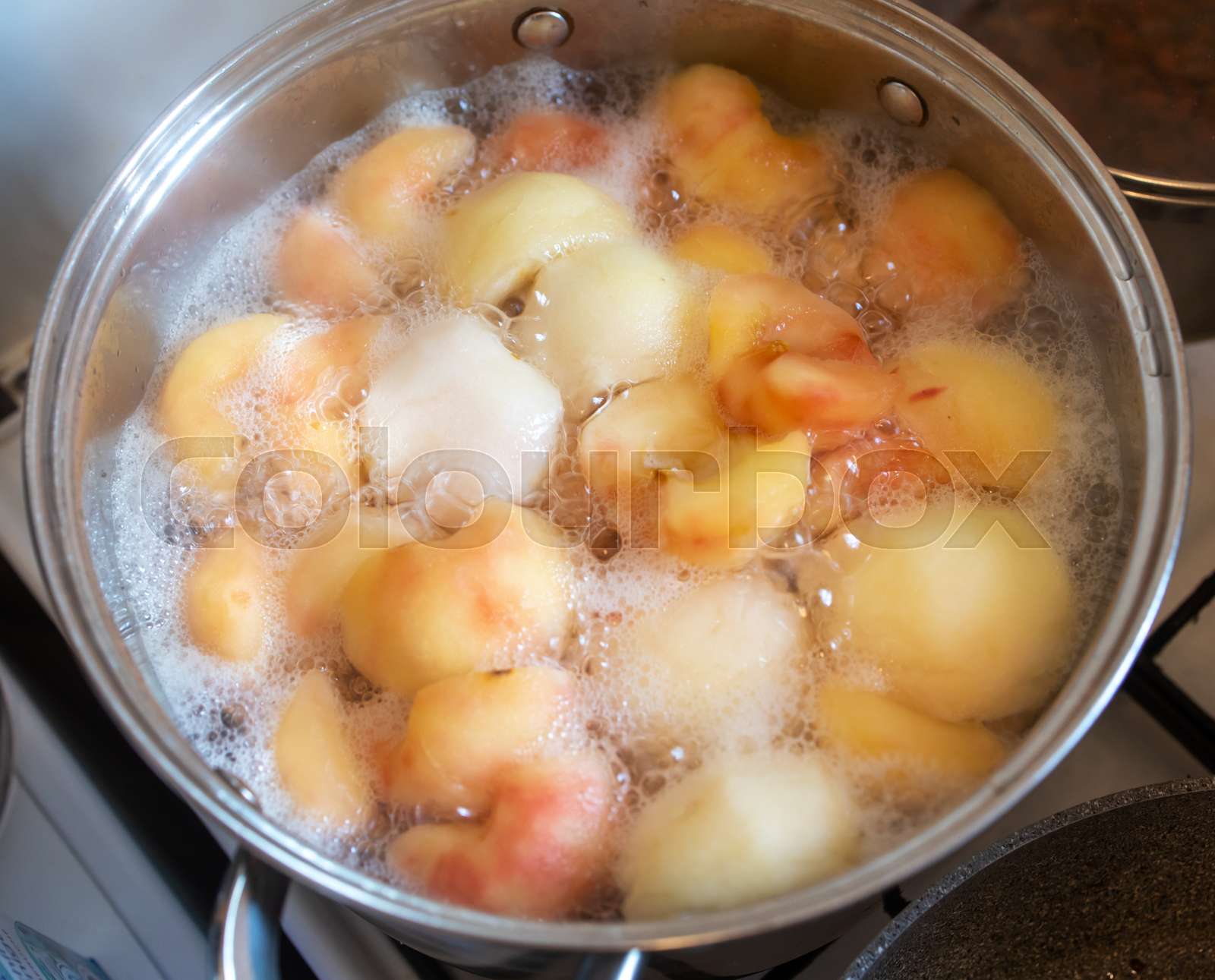 pot of boiling peeled apples | Stock image | Colourbox