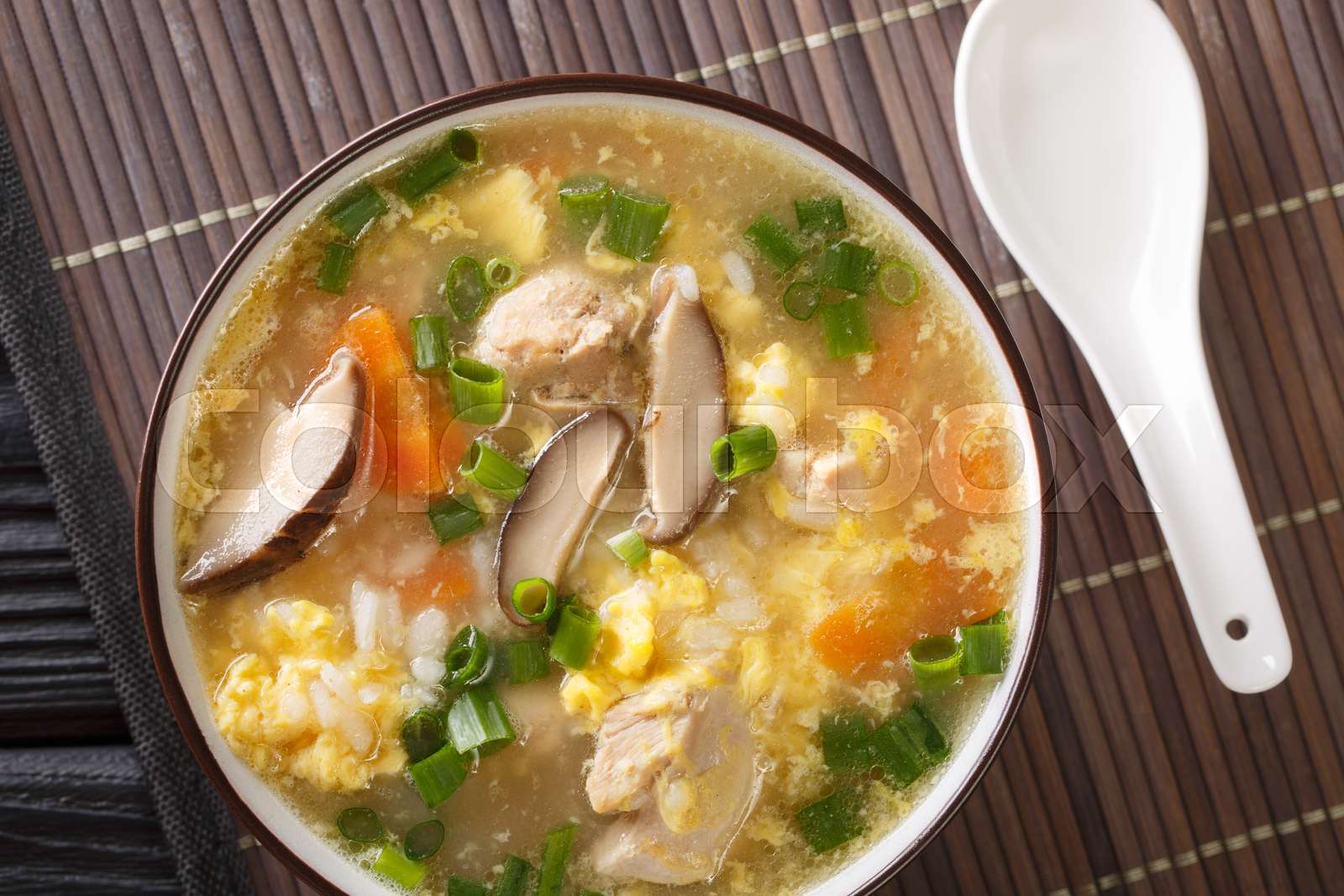 Zosui or ojiya is a mild and thin Japanese winter rice soup with egg ...