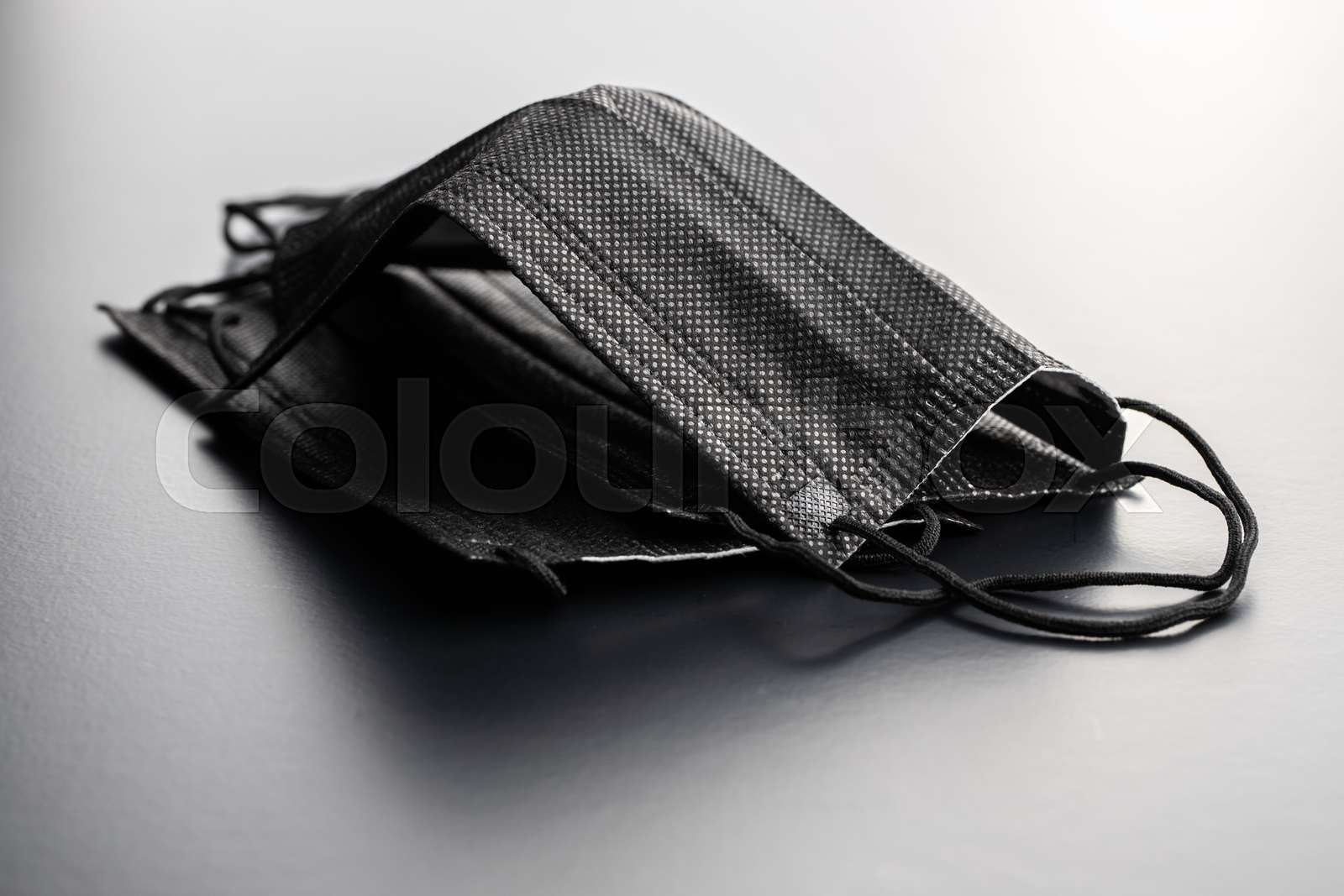 Corona virus protection. Black medical paper face masks | Stock image ...