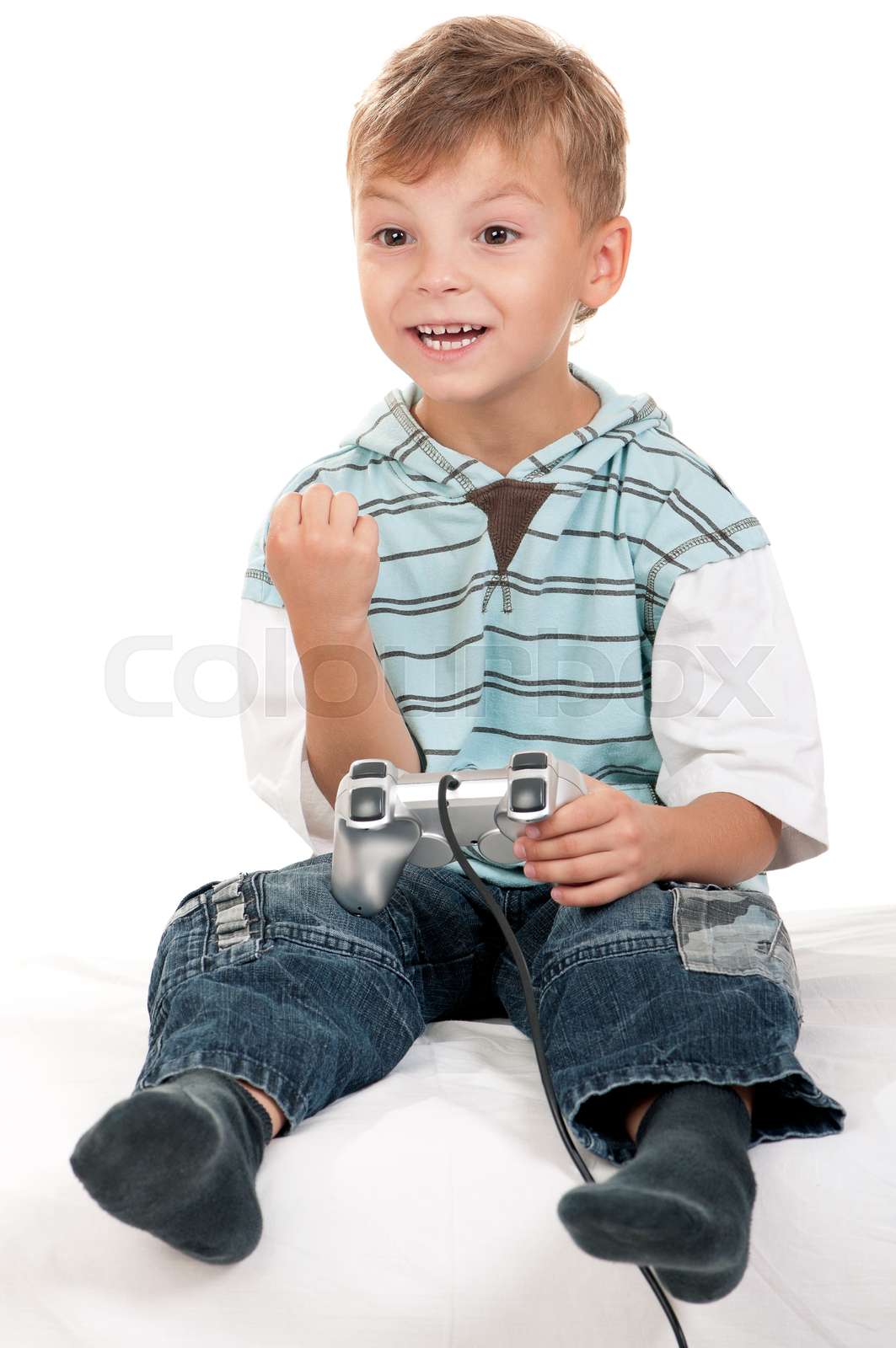 Boy playing with Joystick | Stock image | Colourbox