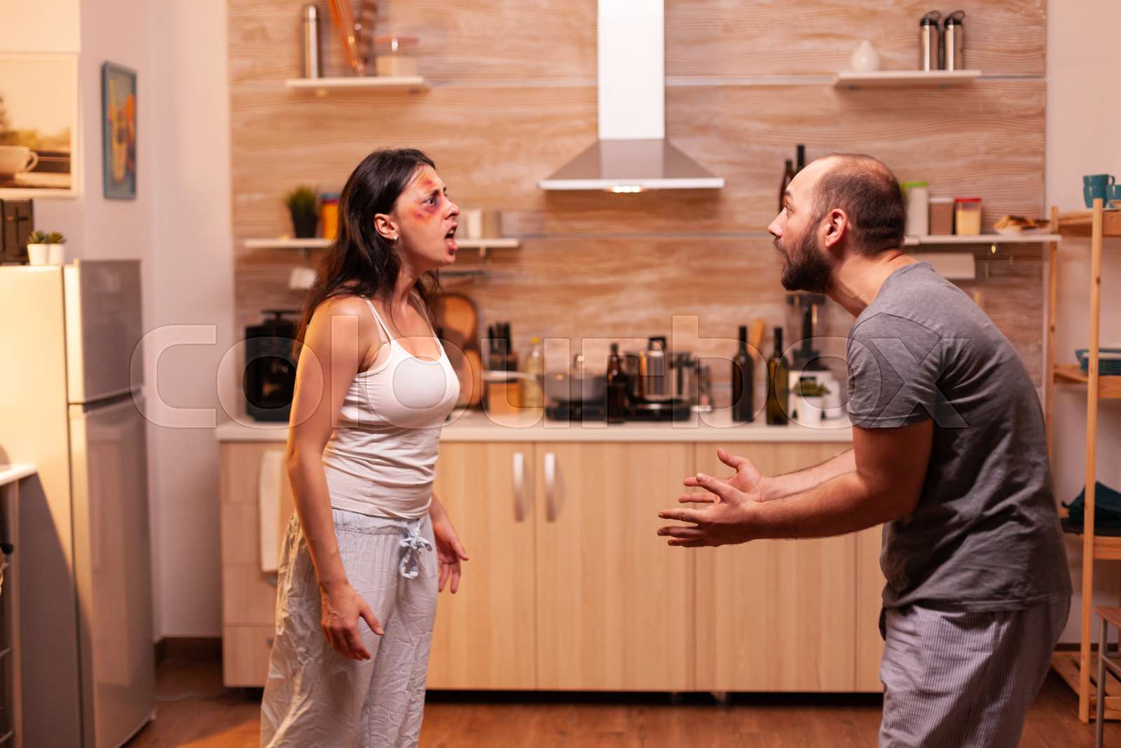 Drunk husband fighting with wife | Stock image | Colourbox