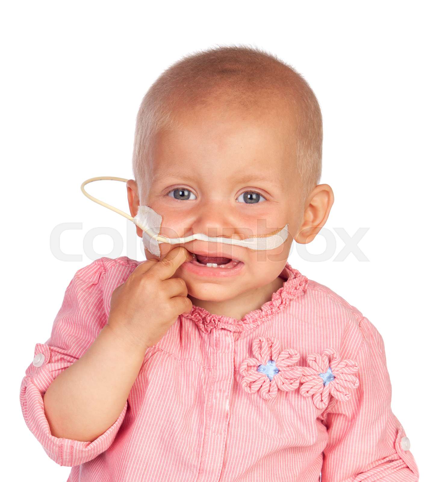 Adorable baby beating the disease. | Stock image | Colourbox