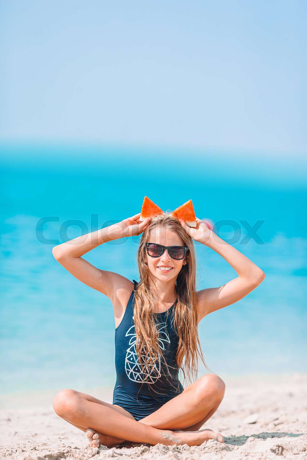 Cute little girl at beach during summer vacation | Stock image | Colourbox