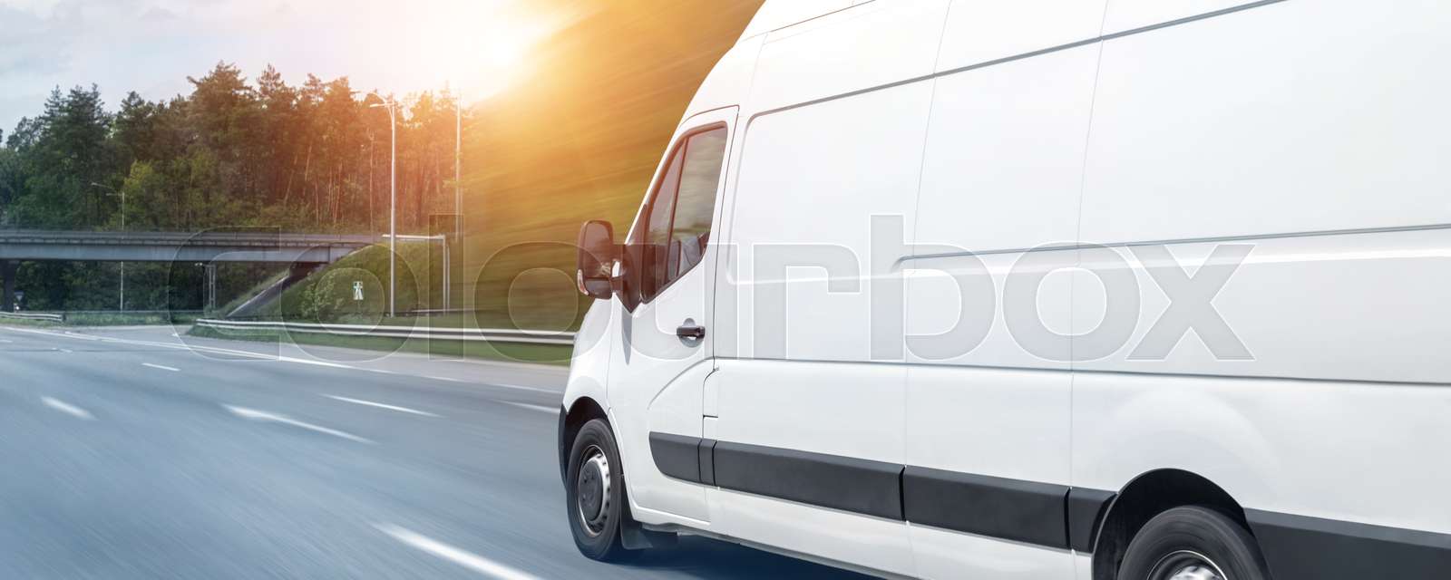 White modern delivery small shipment cargo courier van moving fast on ...