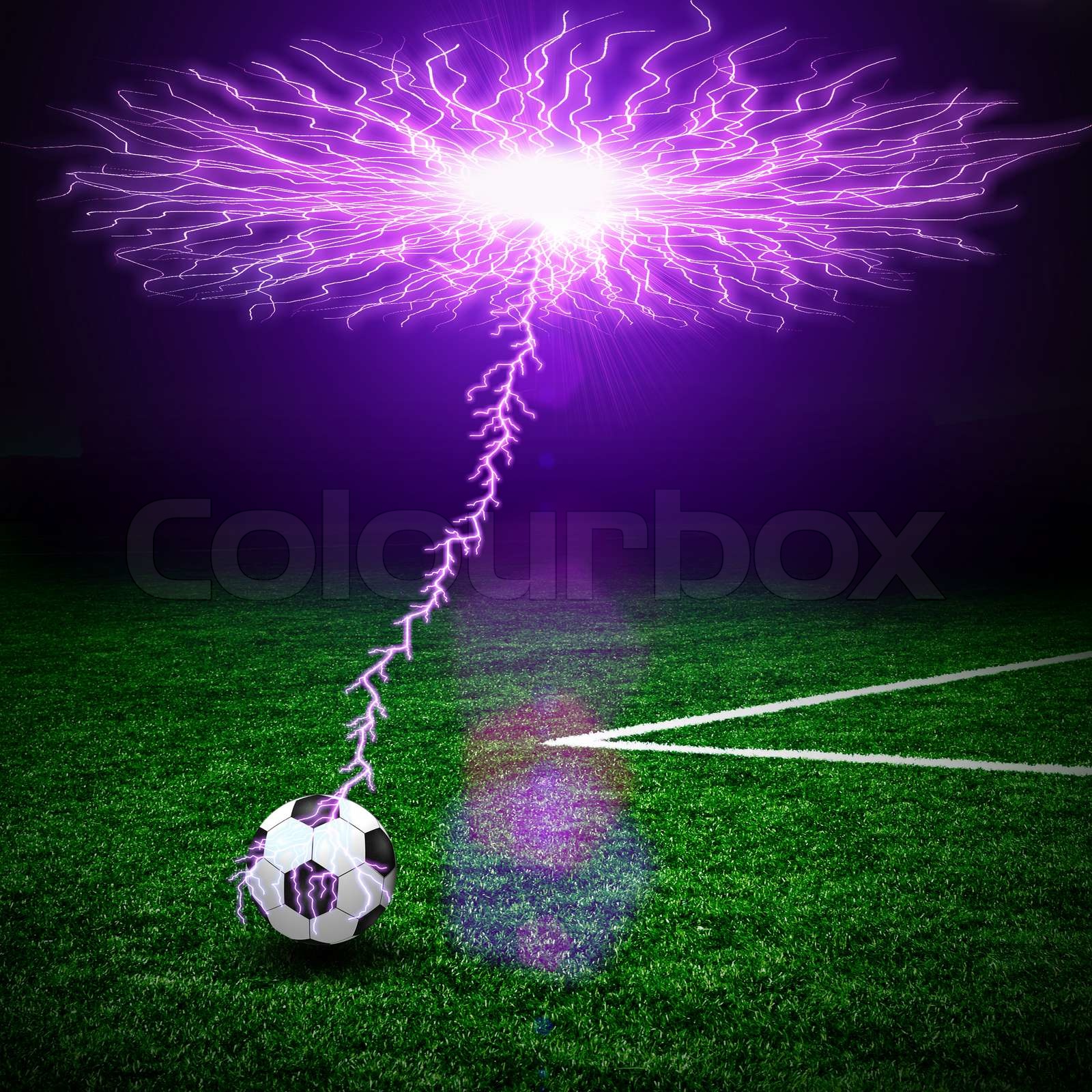 Soccer ball on the green field and lightning | Stock image | Colourbox