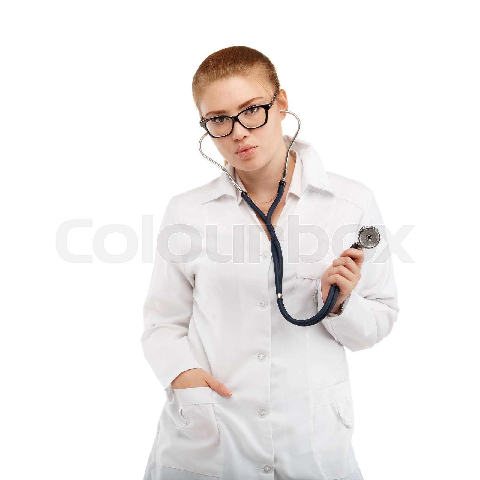 Young pretty female doctor in white uniform | Stock image | Colourbox