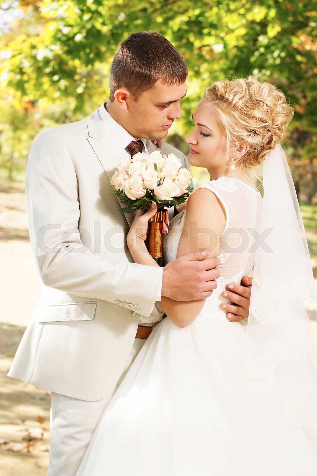 Beautiful young bride and groom in love. | Stock image | Colourbox