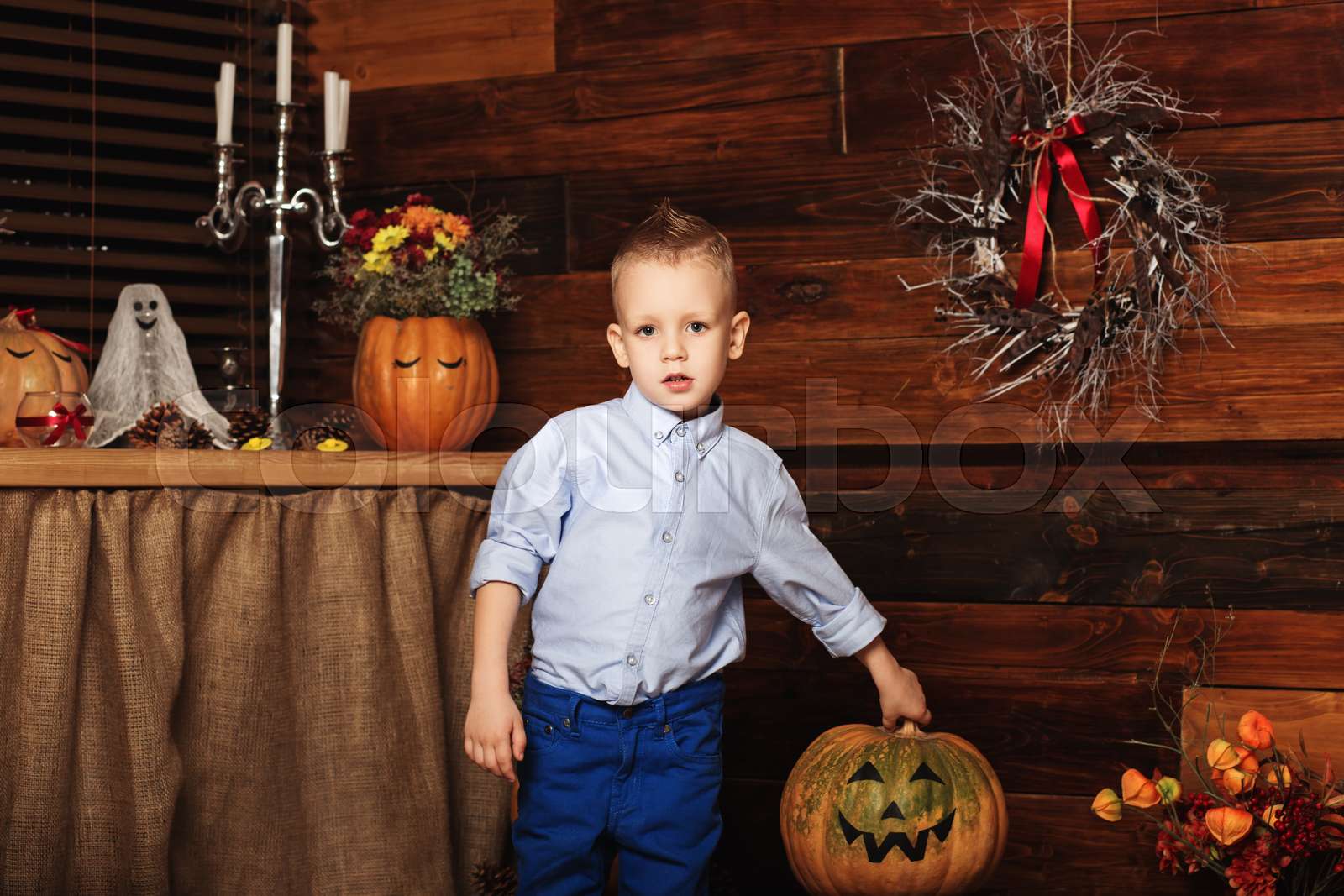 Cute Little Boy having fun in Halloween decorations | Stock image ...