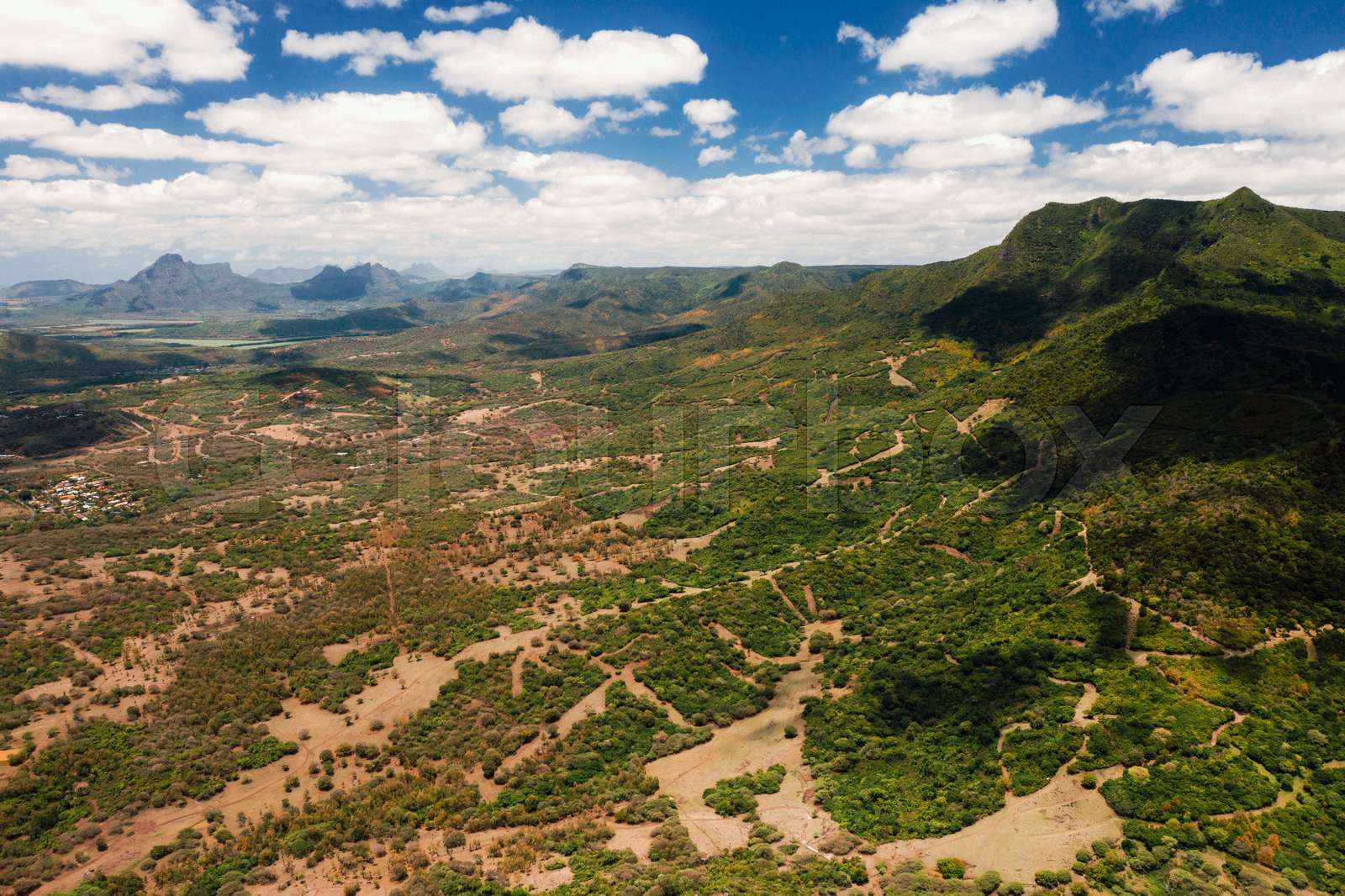 Bird's-eye view of the mountains and fields of the island of Mauritius ...