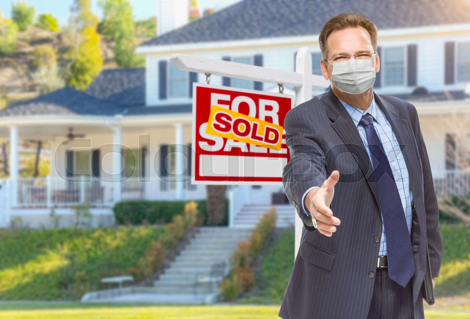 Male Real Estate Agent Reaching for Hand Shake Wearing Medical Face ...