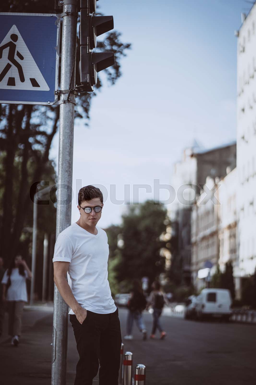 Guy stand on the city street, look camera and around | Stock image ...