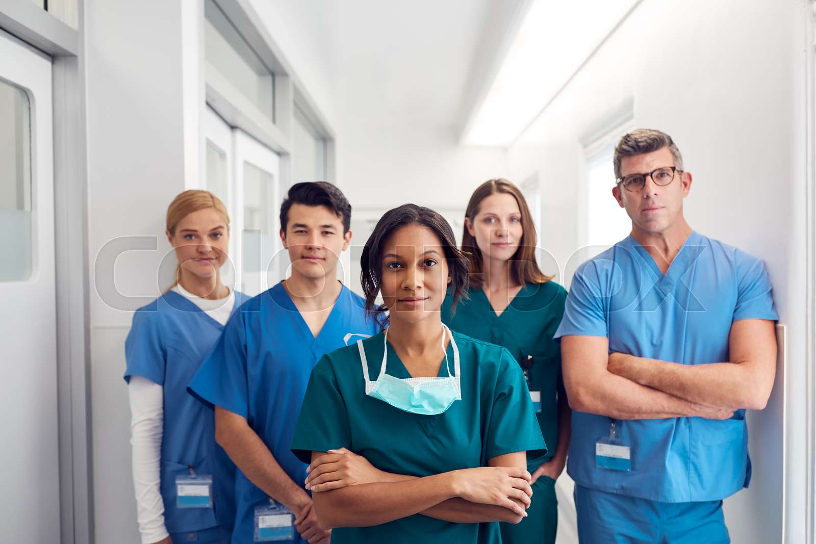 Portrait Of Multi-Cultural Medical Team Standing In Hospital Corridor | Stock image | Colourbox