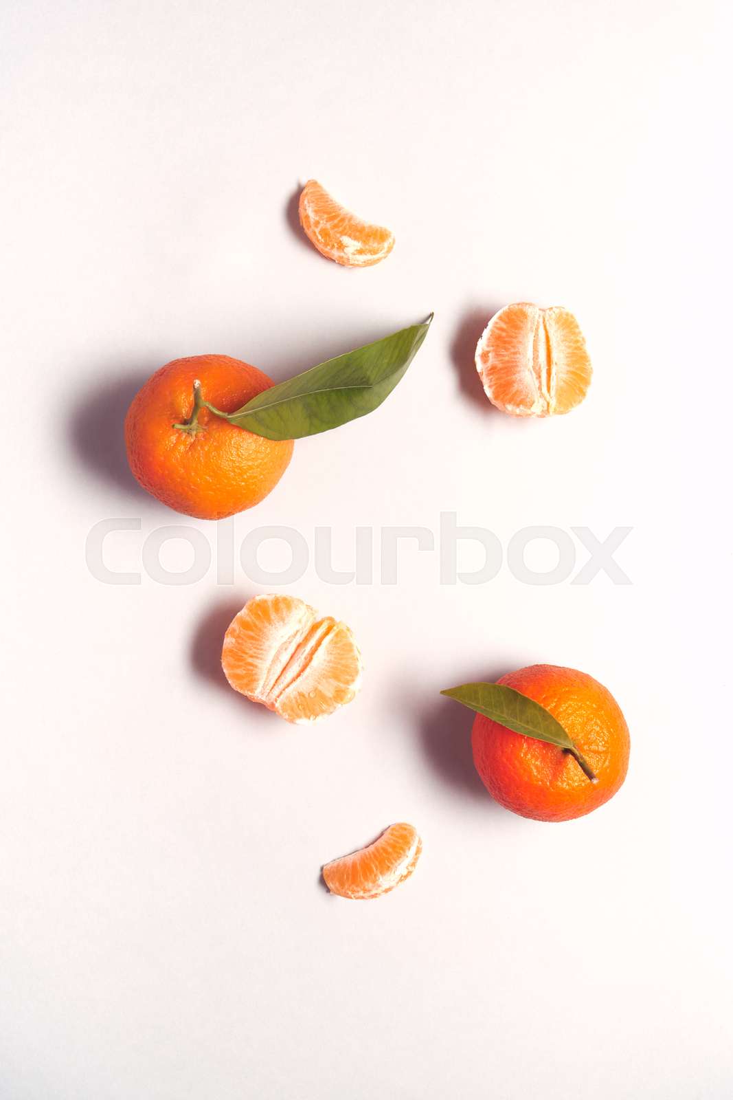 Overhead View Of Whole And Peeled Fresh Satsuma With Leaves On White ...