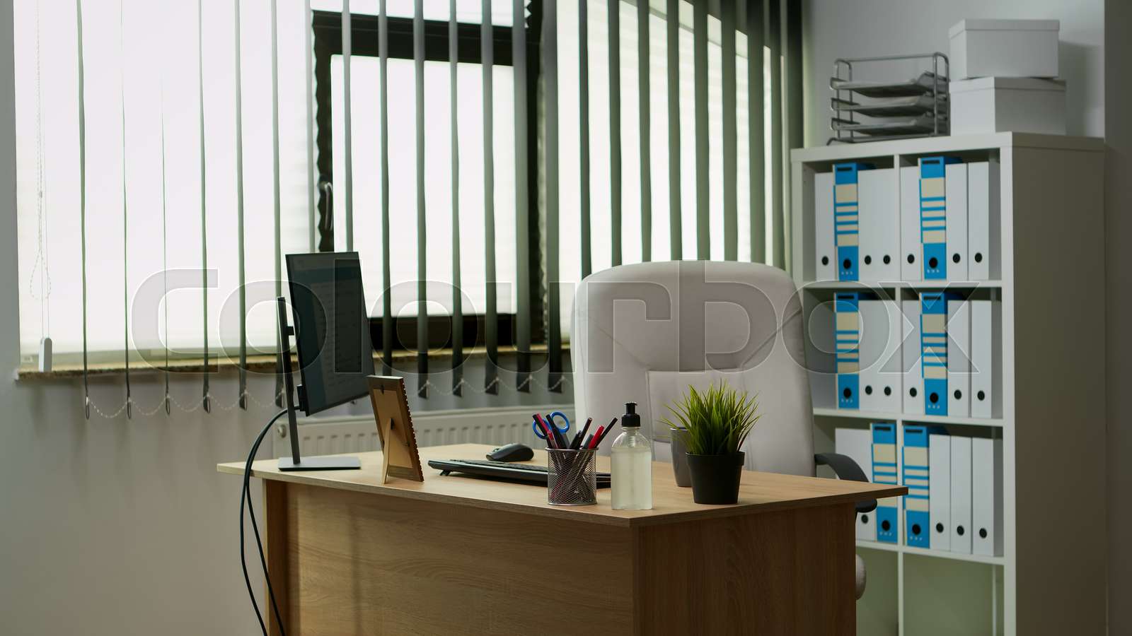 Desk office in empty room | Stock image | Colourbox