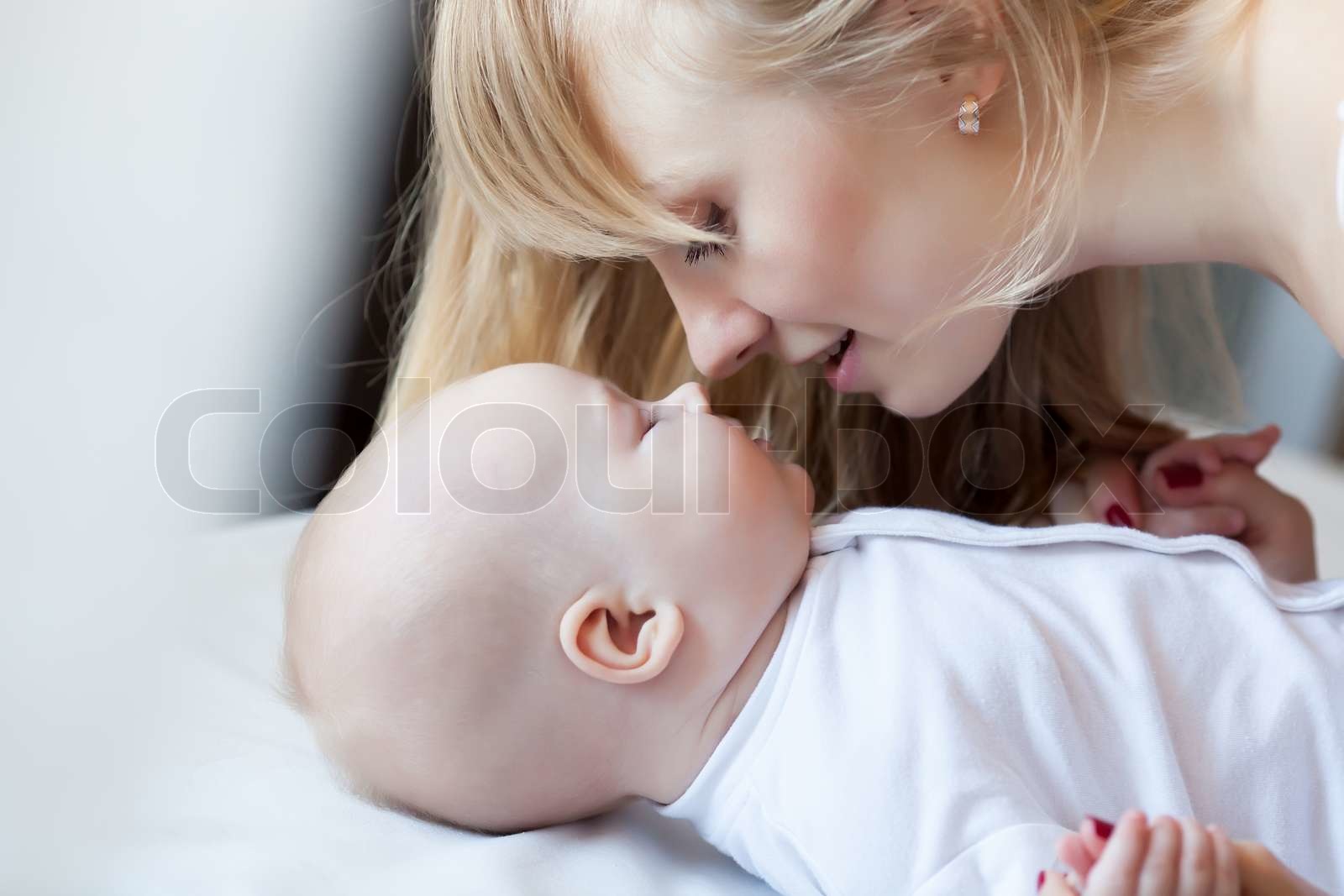 Mother with newborn sun | Stock image | Colourbox