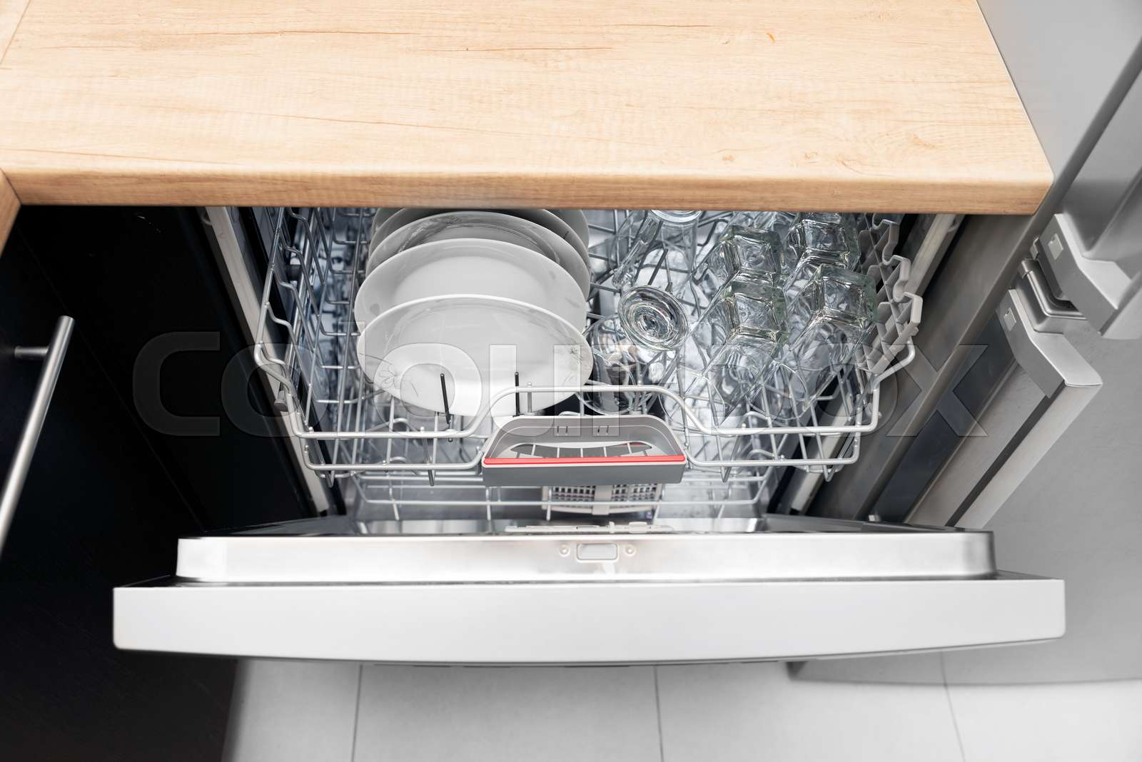Open dishwasher with clean dishes | Stock image | Colourbox