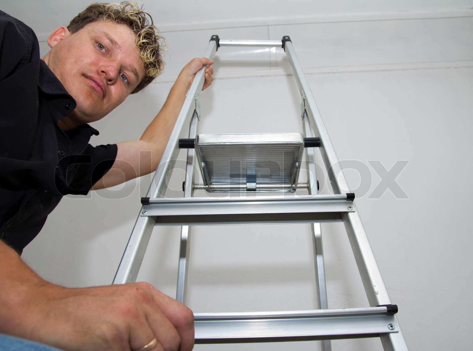a man with a ladder | Stock image | Colourbox
