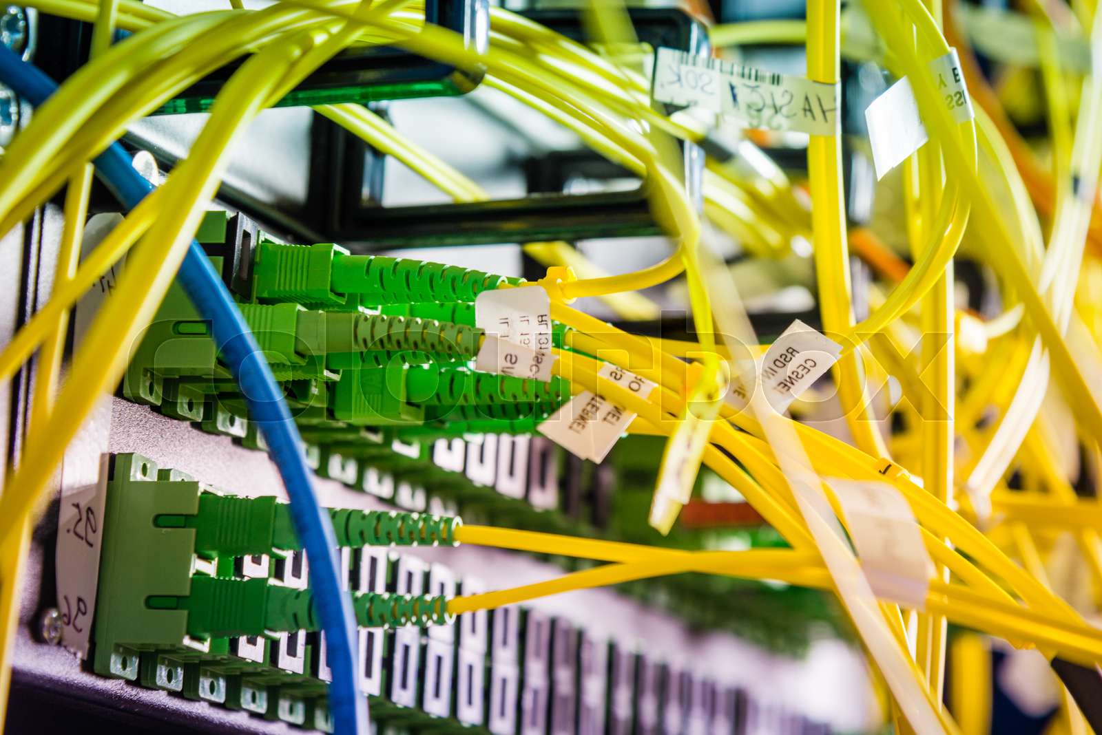 detail of server rack with fiber optic cables attached to front | Stock ...