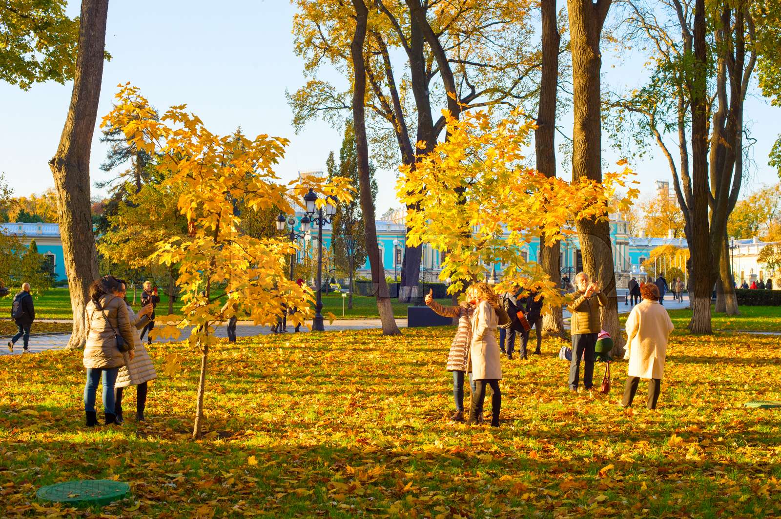 People autumn park leaves photo | Stock image | Colourbox