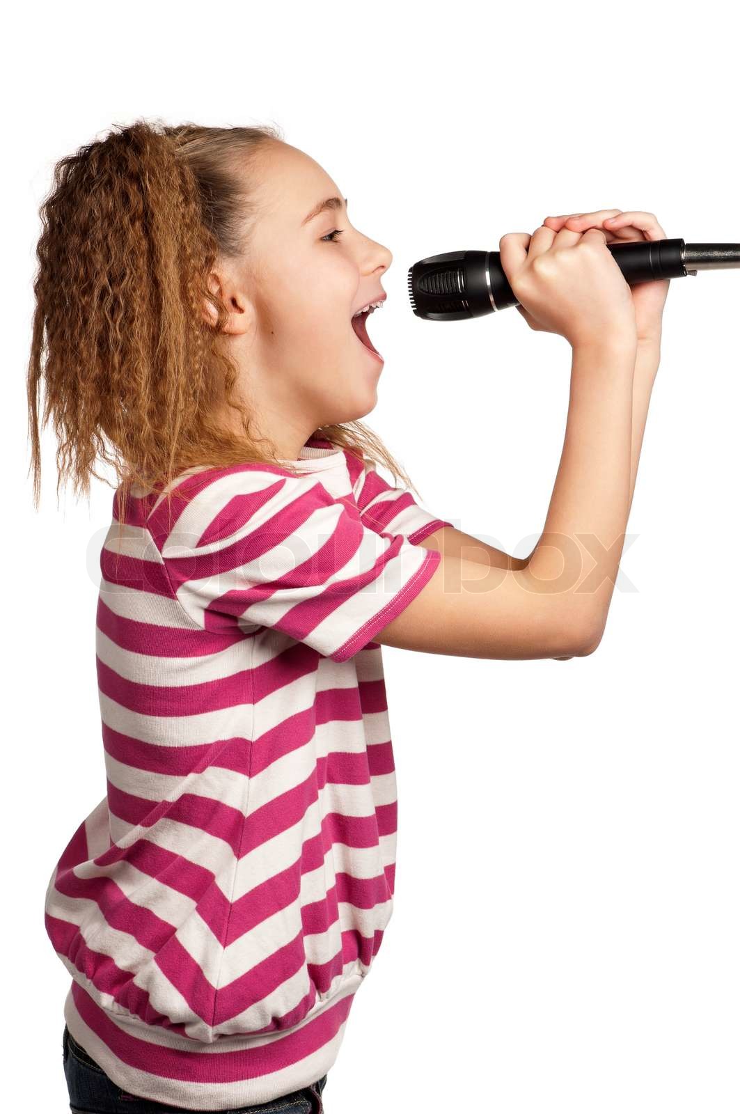 Girl with microphone | Stock image | Colourbox