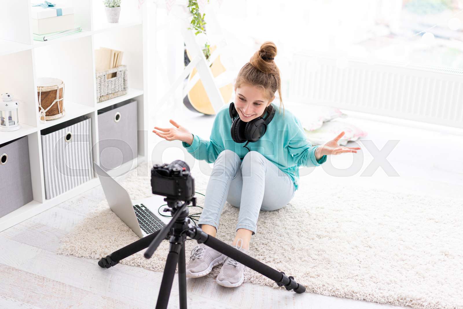 Happy girl making video blog at home | Stock image | Colourbox