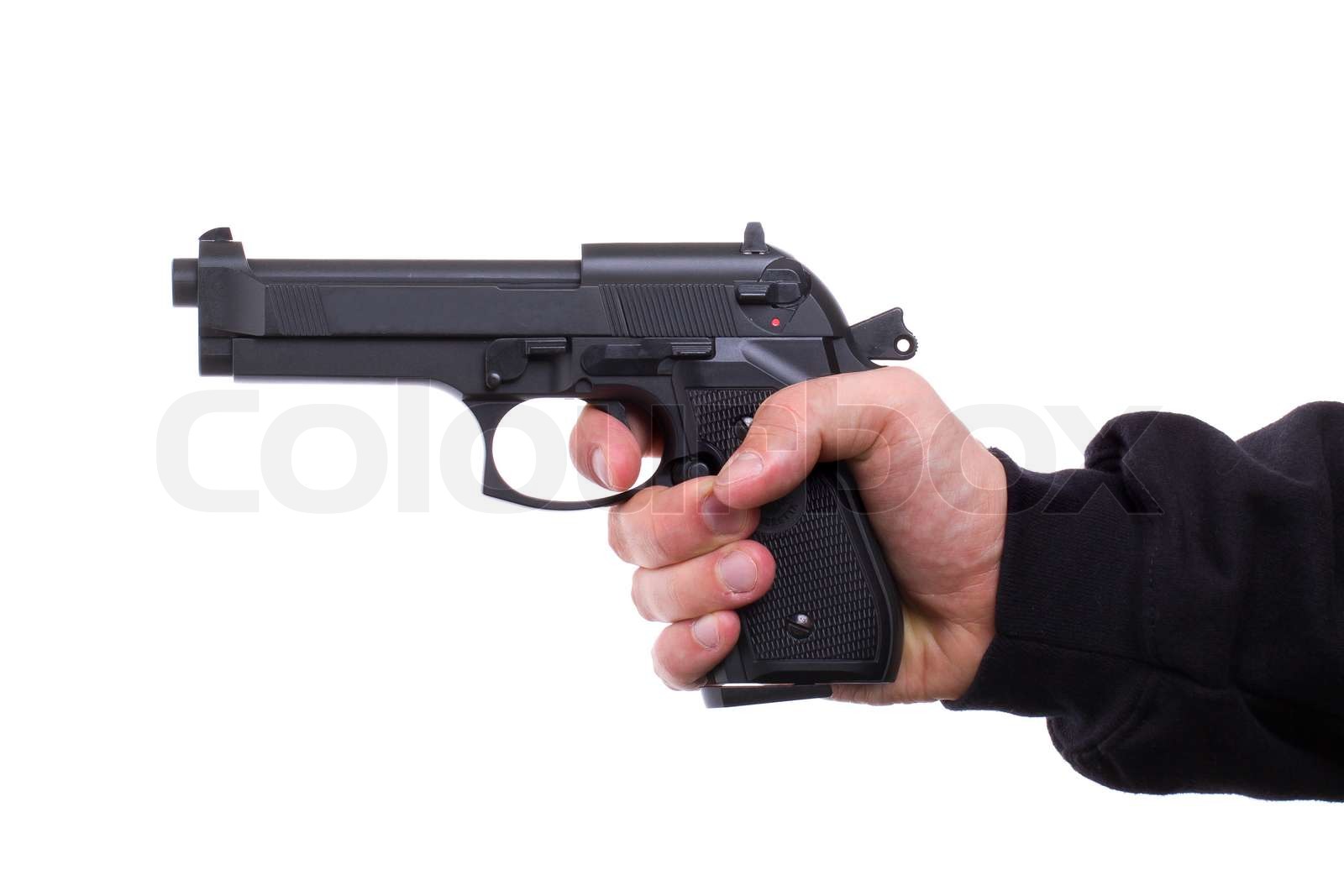 Pistol in hand | Stock image | Colourbox